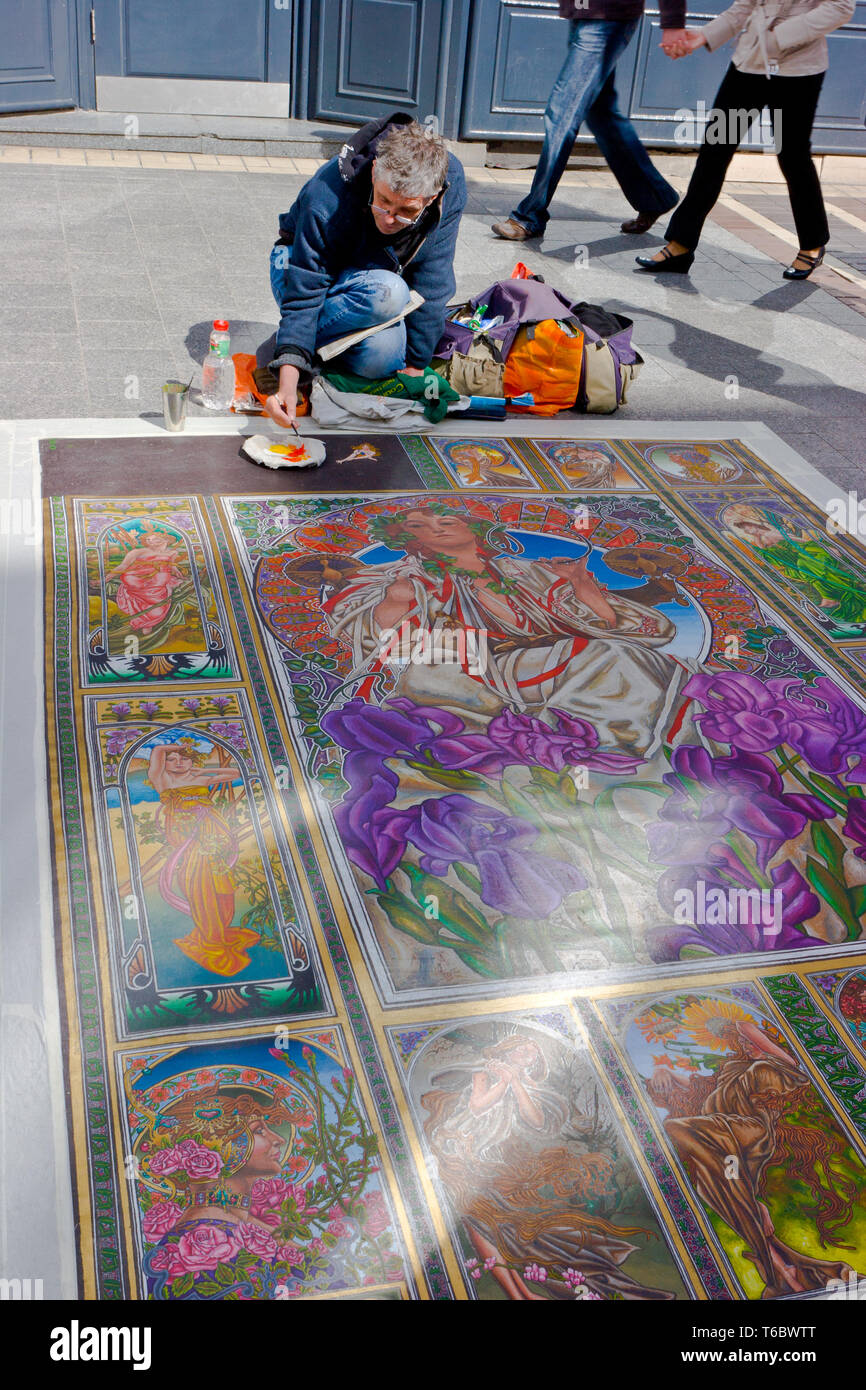 Sidewalk artist creating colorful artwork in Dublin, Ireland Stock ...