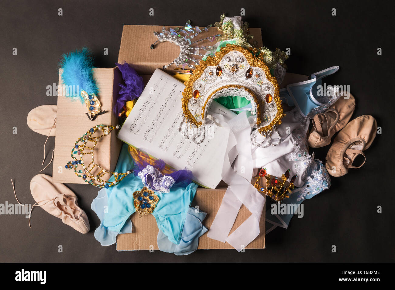 cardboard box with clothes for dancing on dark background Stock Photo ...
