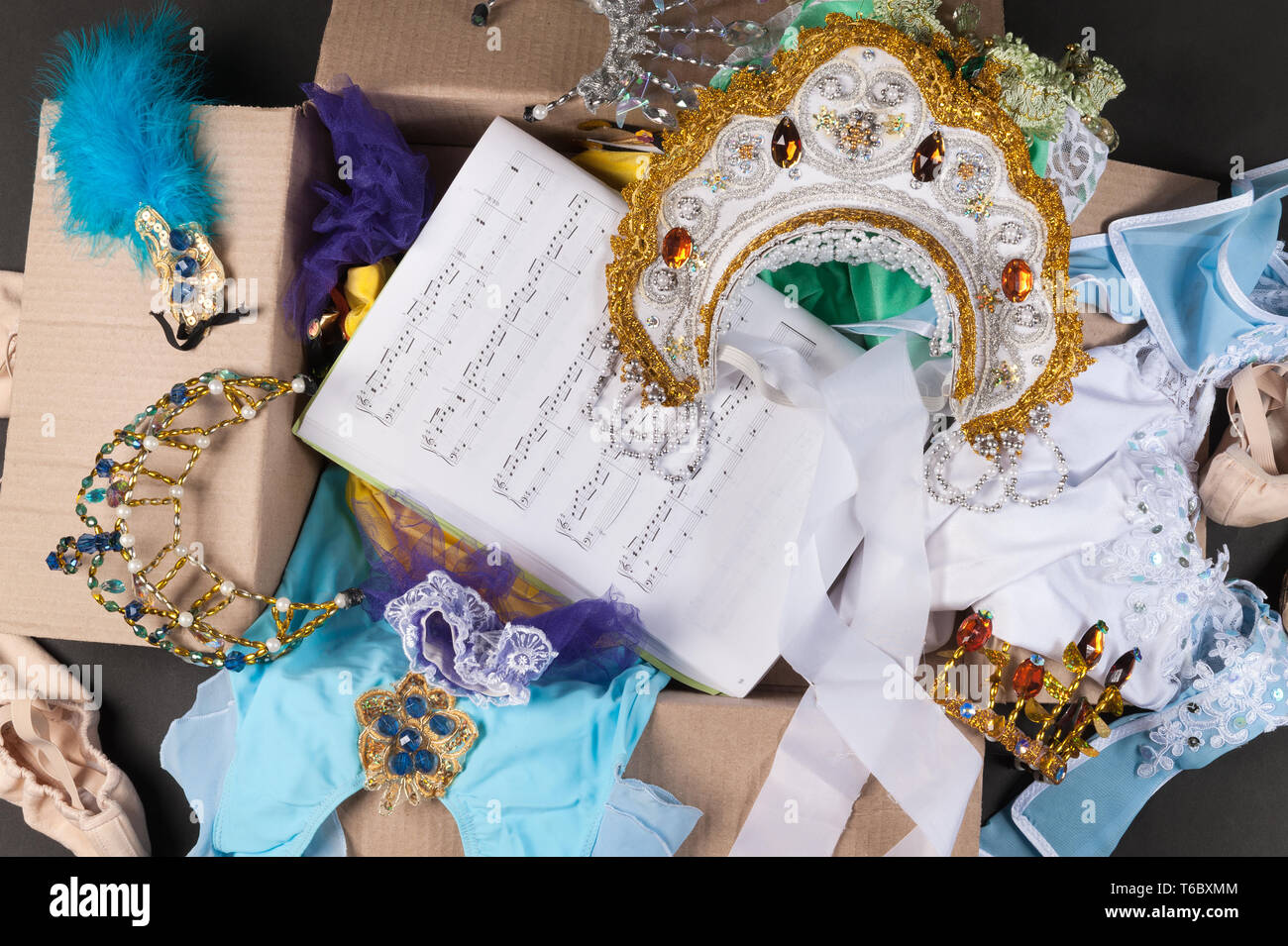 cardboard box with clothes for dancing on dark background Stock Photo ...