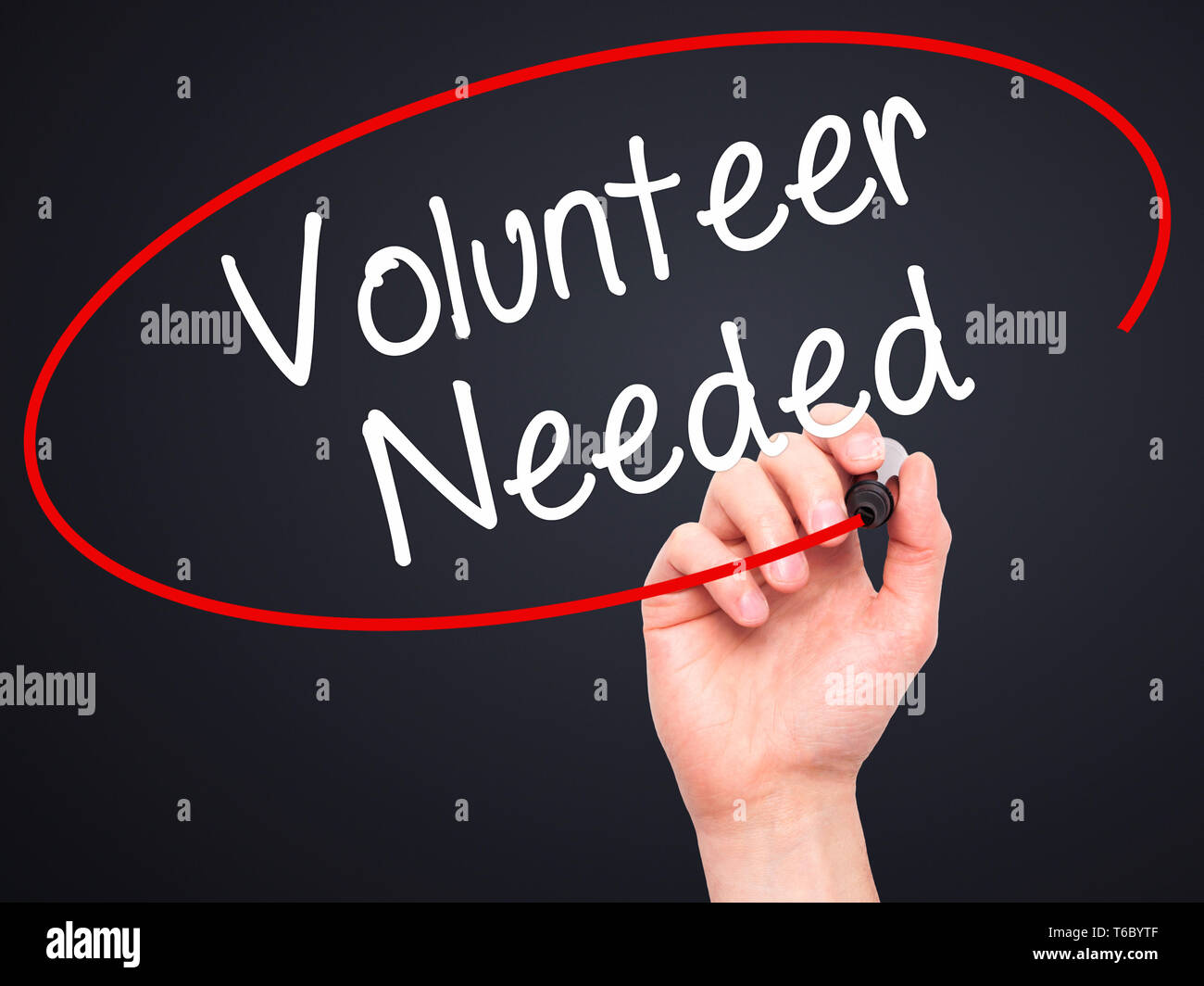 Man Hand writing Volunteer Needed with black marker on visual screen ...