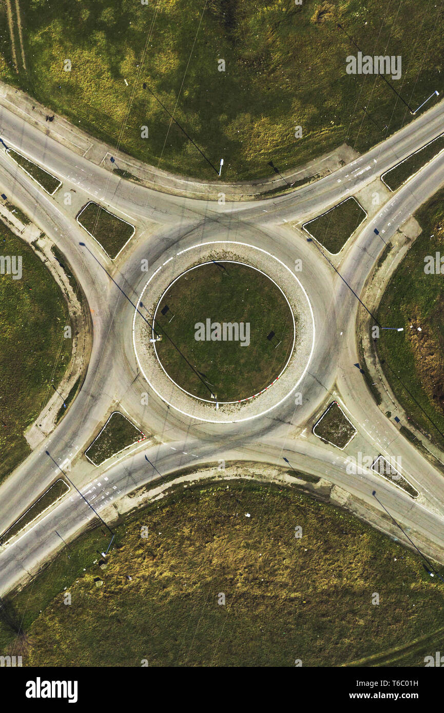 Aerial view of traffic circle roundabout road junction, top view with ...