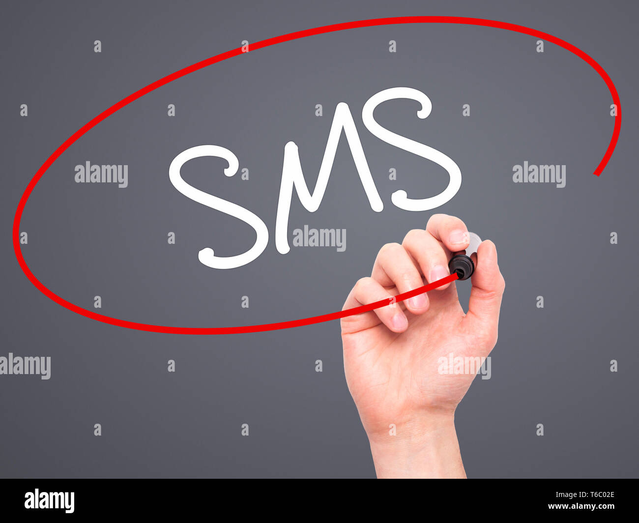 Man Hand writing SMS (Short Message Service) with black marker on ...