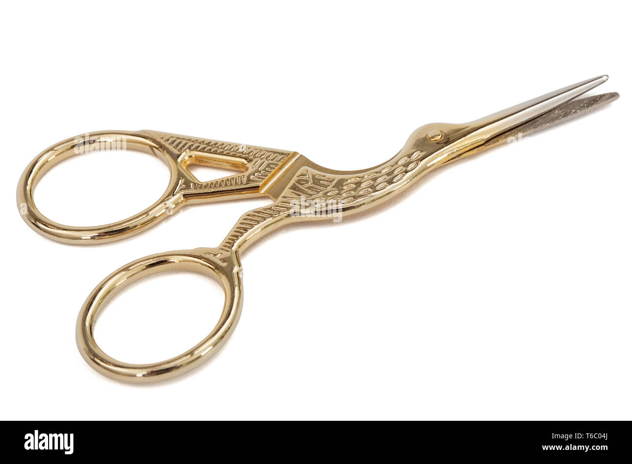 Scissors with curly handles in the shape of a bird, with clipping path ...