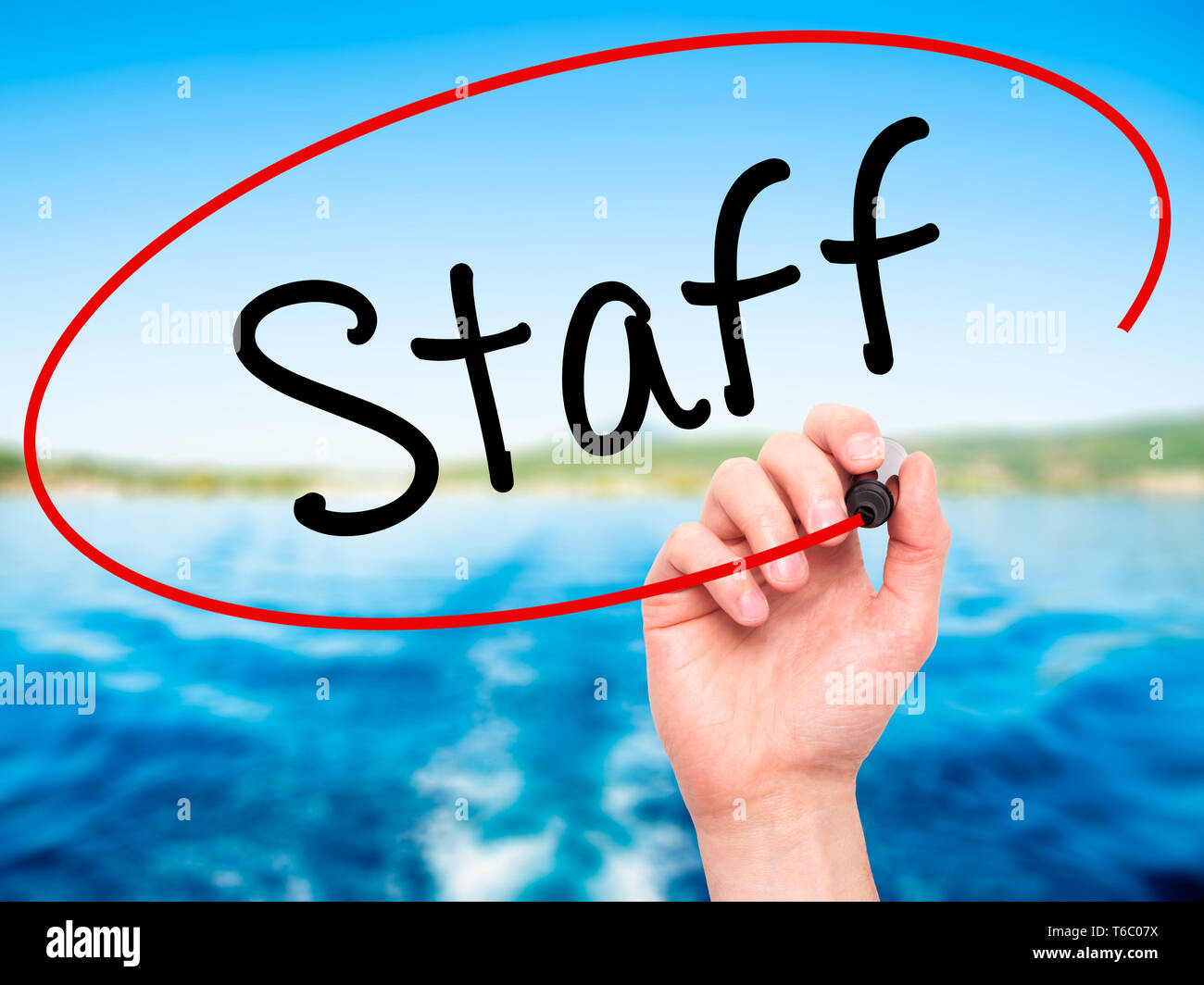 Man Hand writing Staff with black marker on visual screen Stock Photo ...