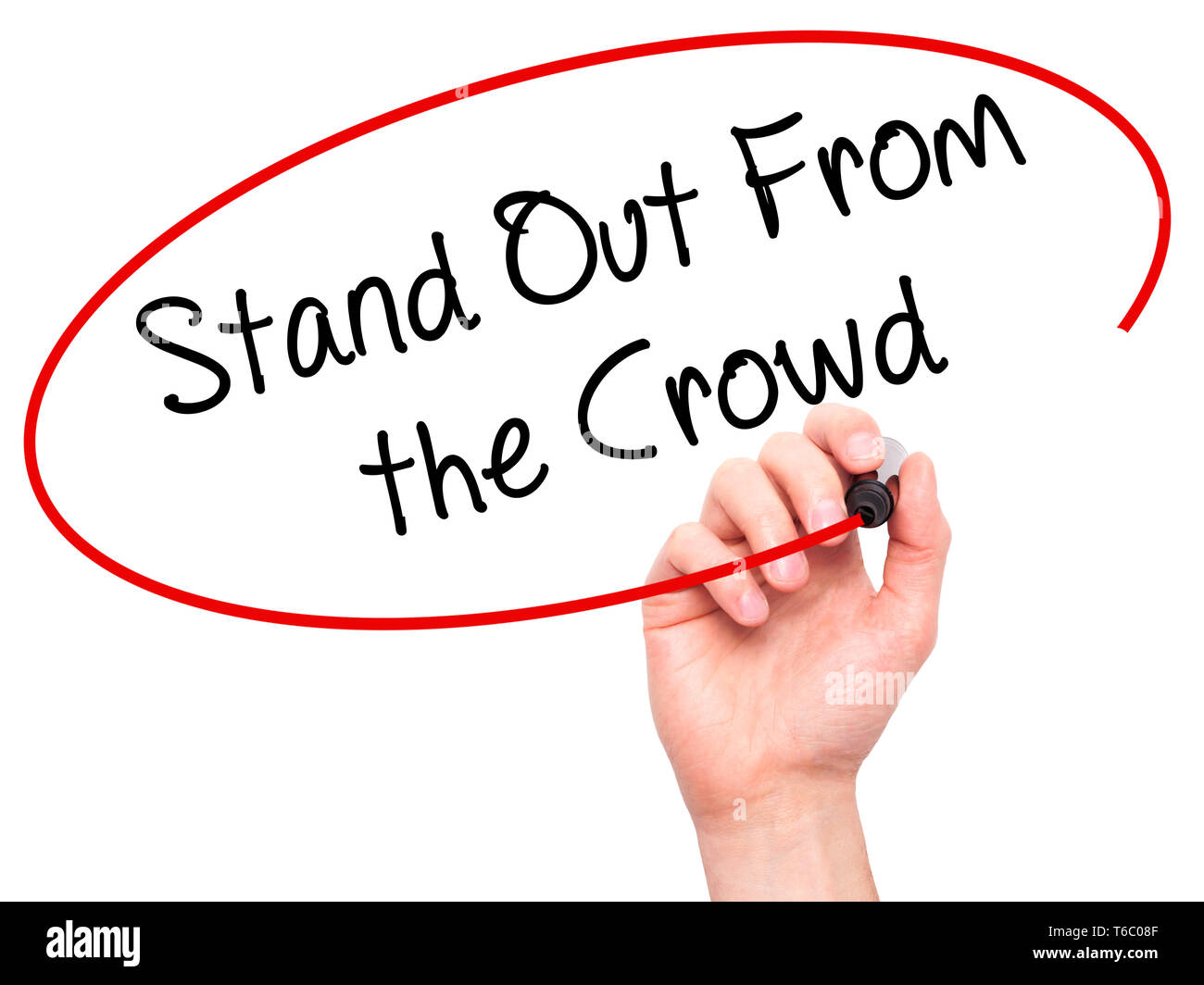 Man Hand writing Stand Out From the Crowd with black marker on visual ...