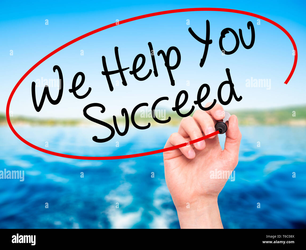 Man Hand writing We Help You Succeed with black marker on visual screen ...