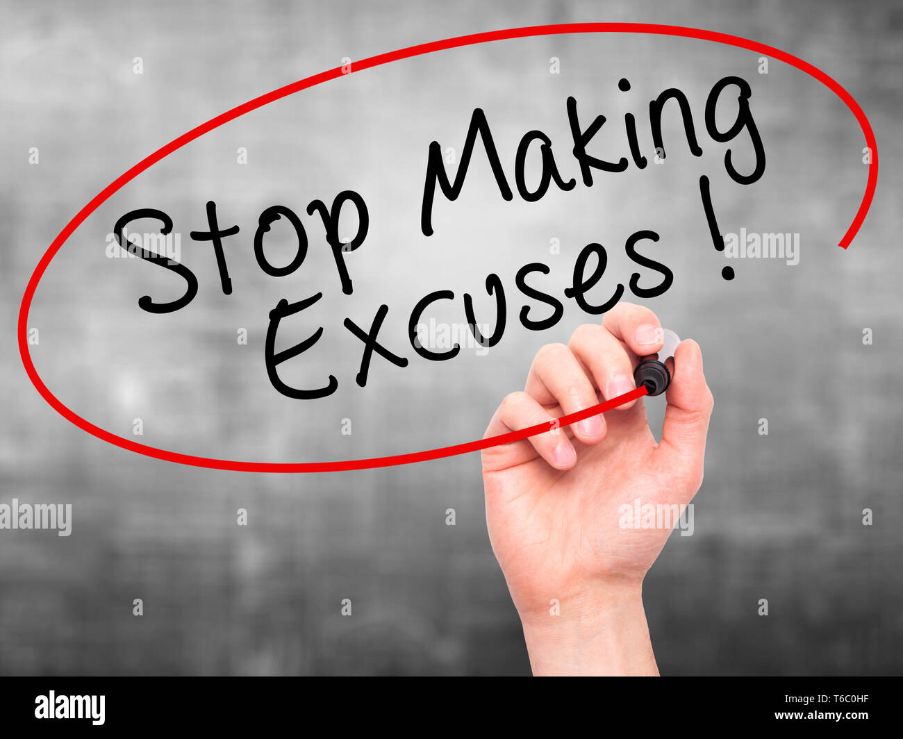 Man Hand writing Stop Making Excuses with black marker on visual screen ...