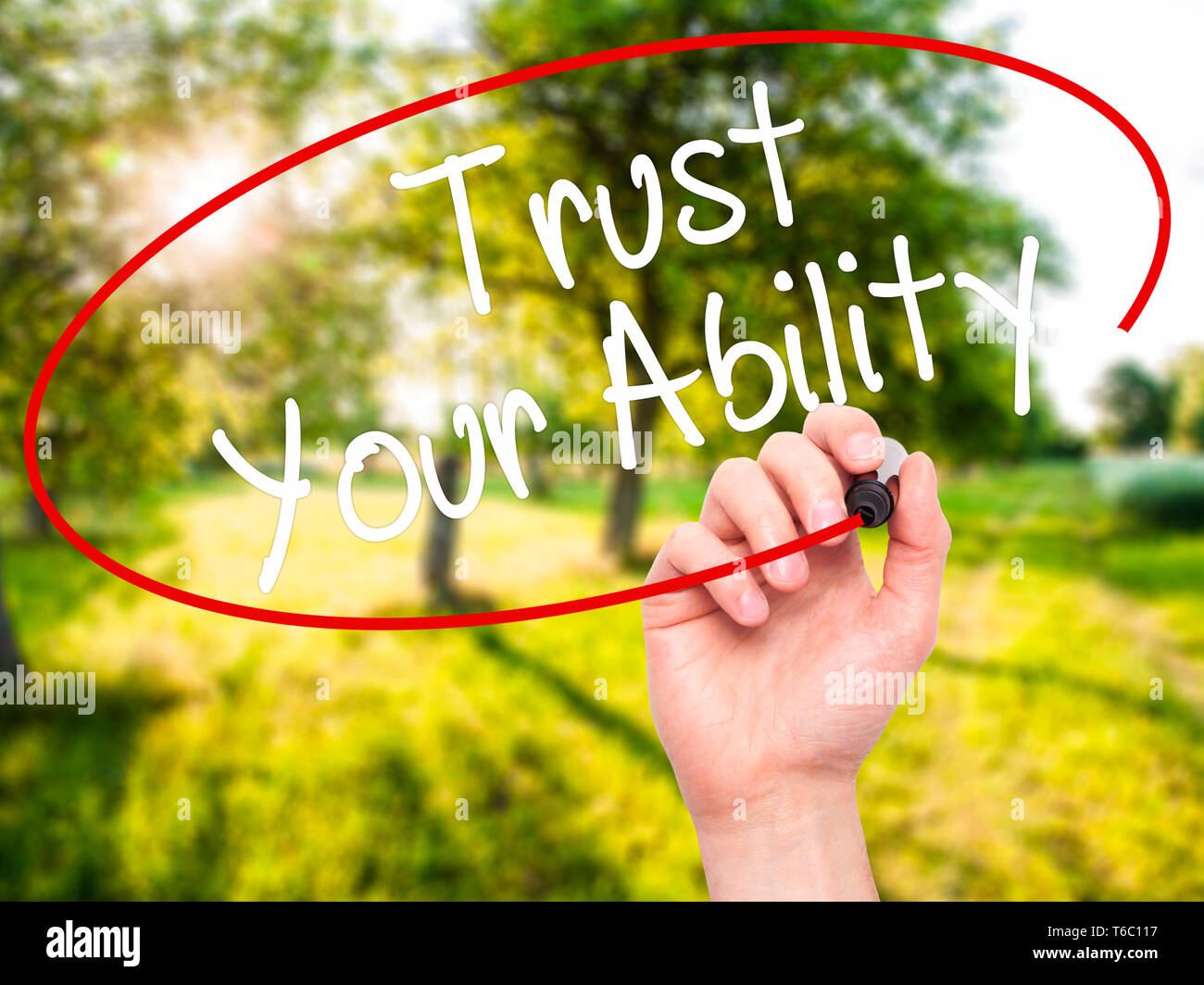 Man Hand writing Trust Your Ability with black marker on visual screen ...