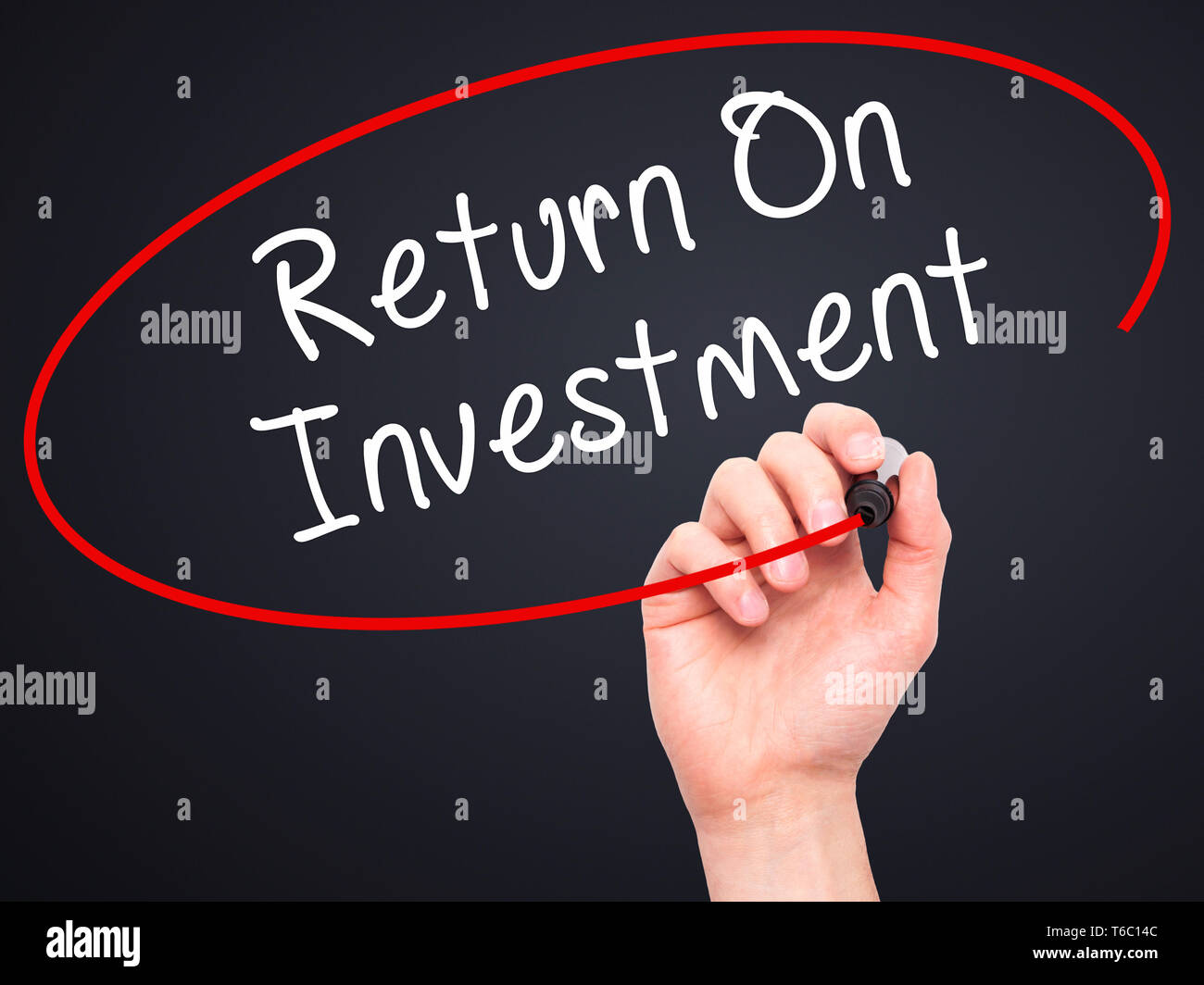 Man Hand writing Return On Investment with black marker on visual ...