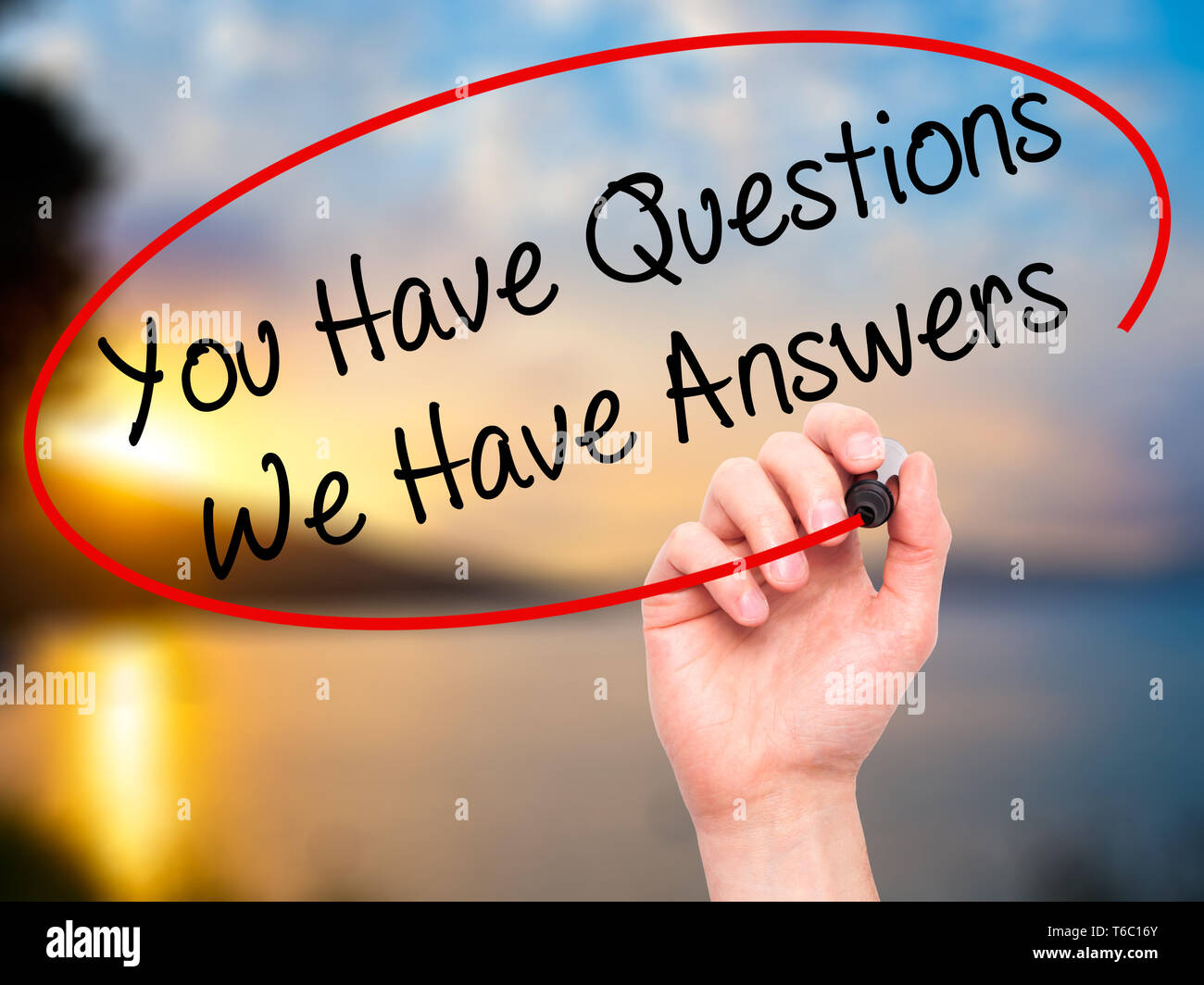 Man Hand writing You Have Questions We Have Answers with black marker ...