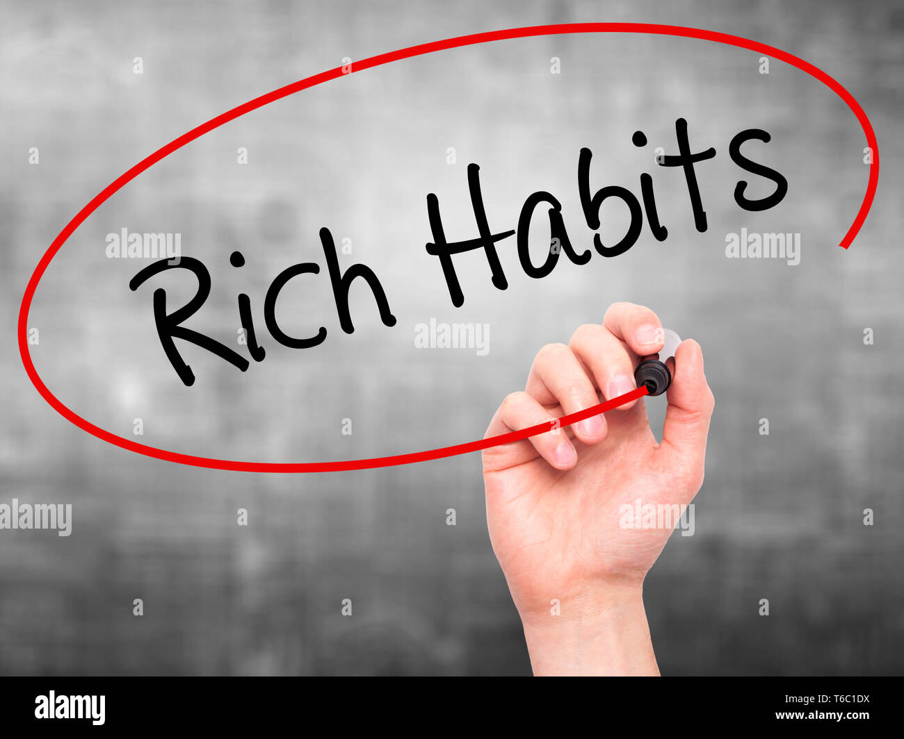 Man Hand writing Rich Habits with black marker on visual screen Stock ...