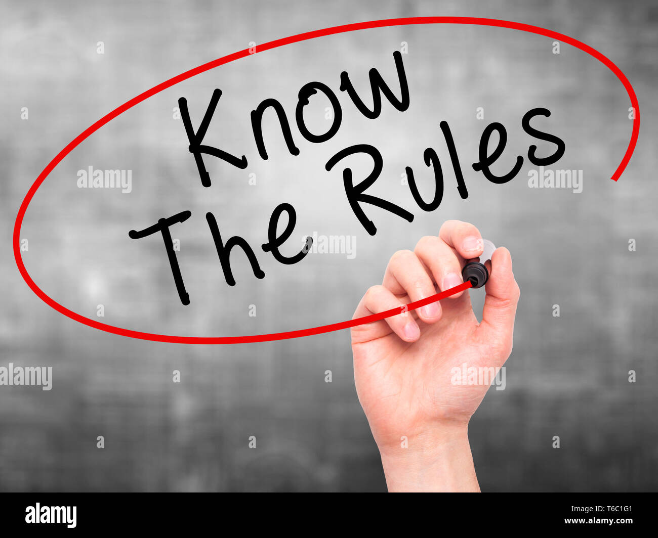 Man Hand writing Know The Rules with marker on transparent wipe board ...