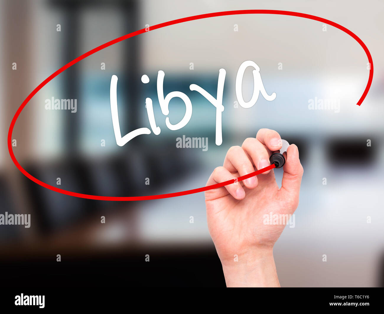 Man Hand writing Libya with black marker on visual screen Stock Photo ...