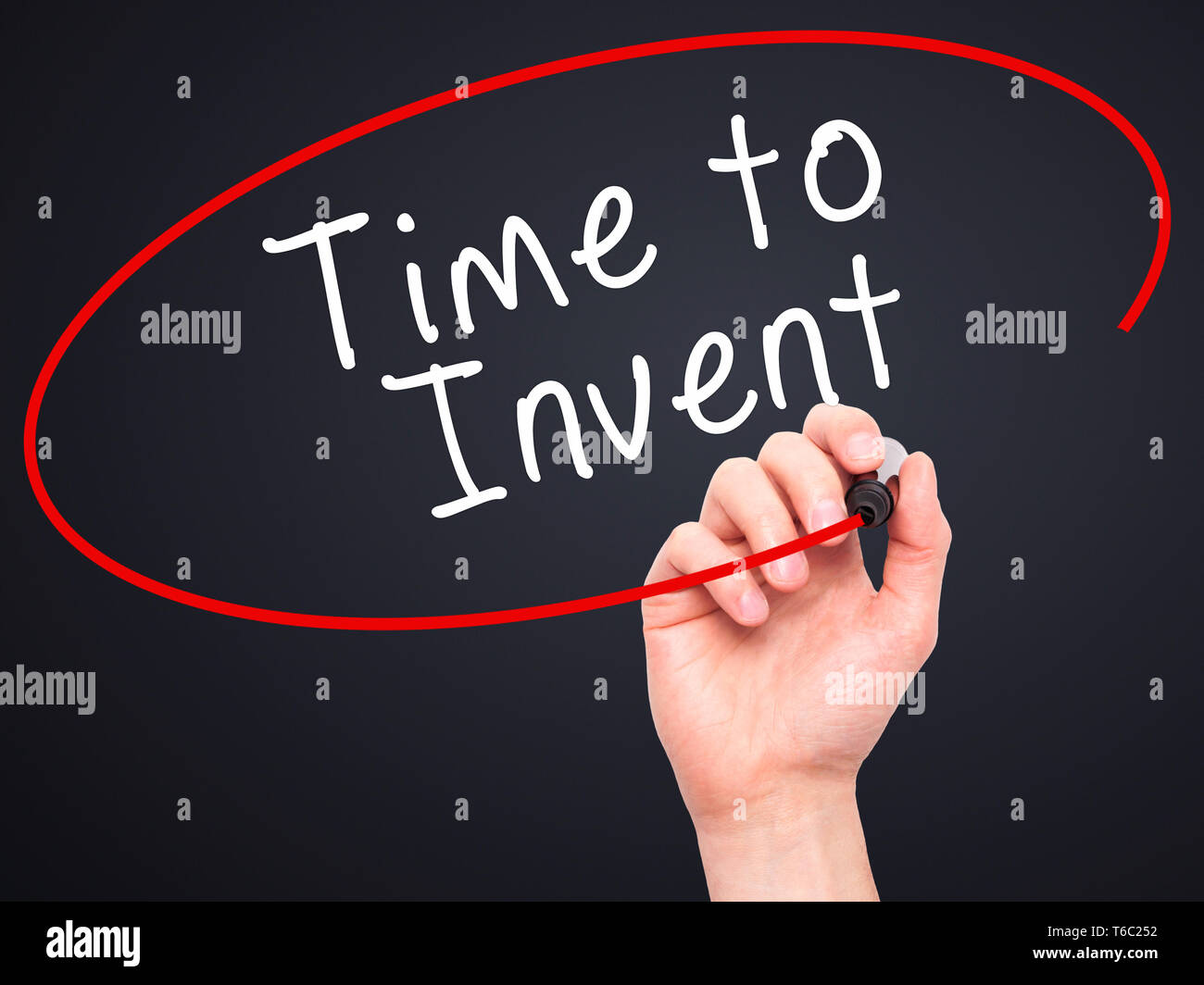 Man Hand writing Time to Invent with black marker on visual screen ...