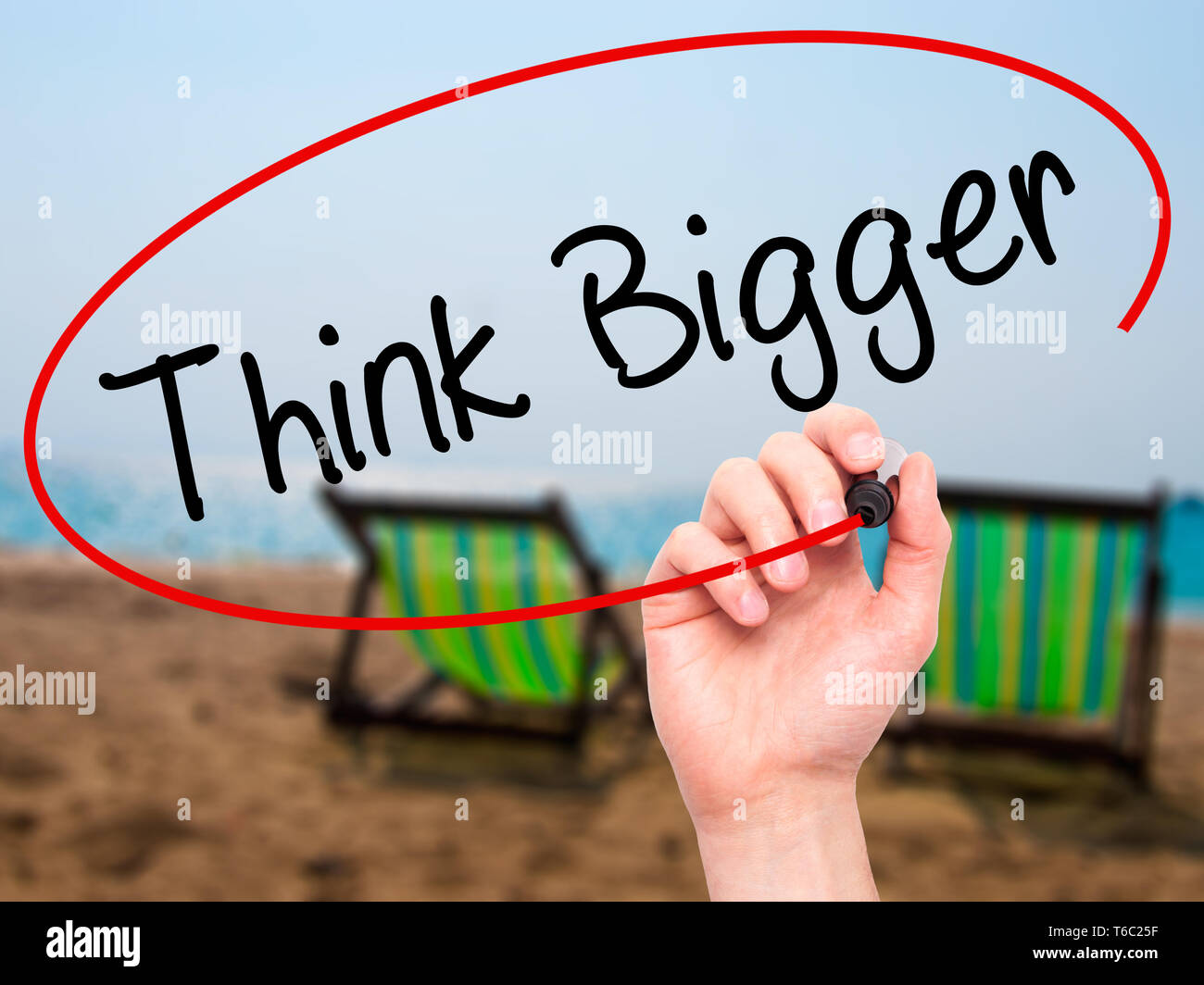 Man Hand writing Think Bigger with black marker on visual screen Stock ...