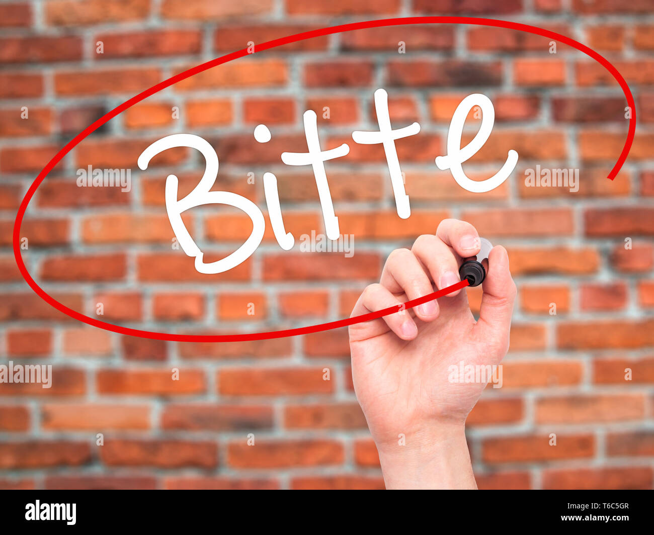 Man Hand writing Bitte (Please in German) with black marker on visual ...