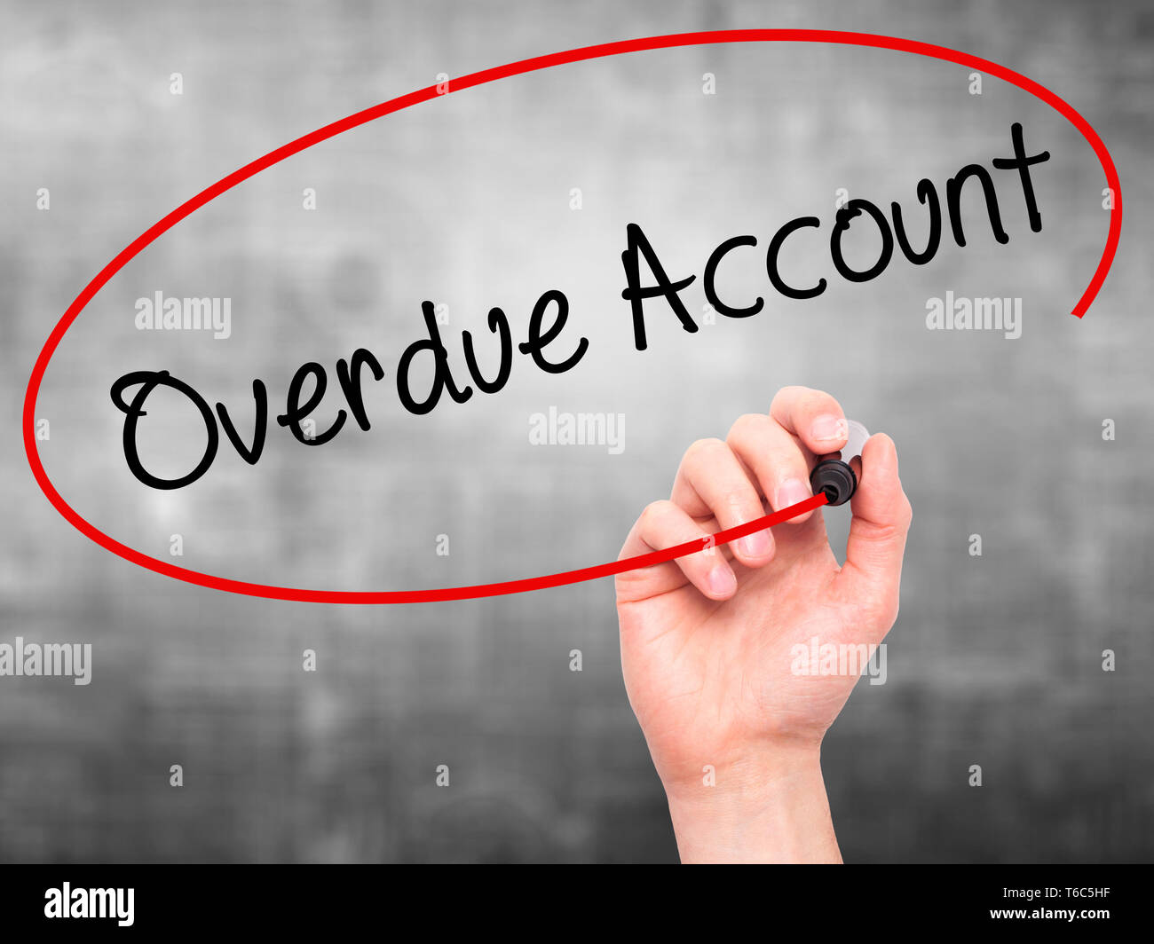 Man Hand writing Overdue Account with black marker on visual screen ...