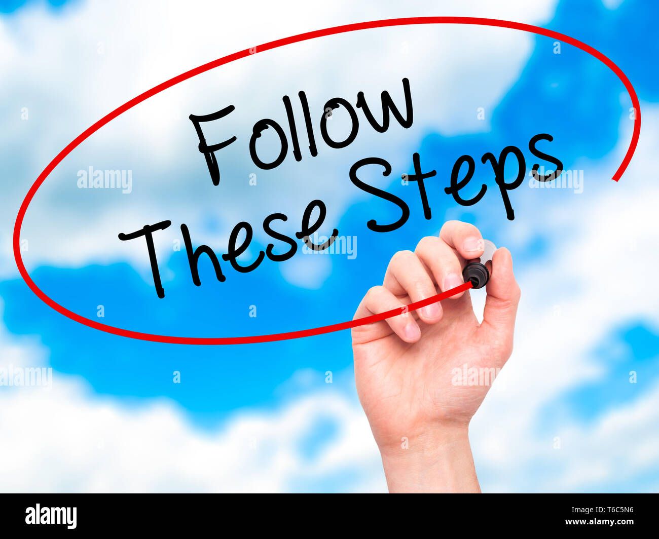 Man Hand writing Follow These Steps with black marker on visual screen ...