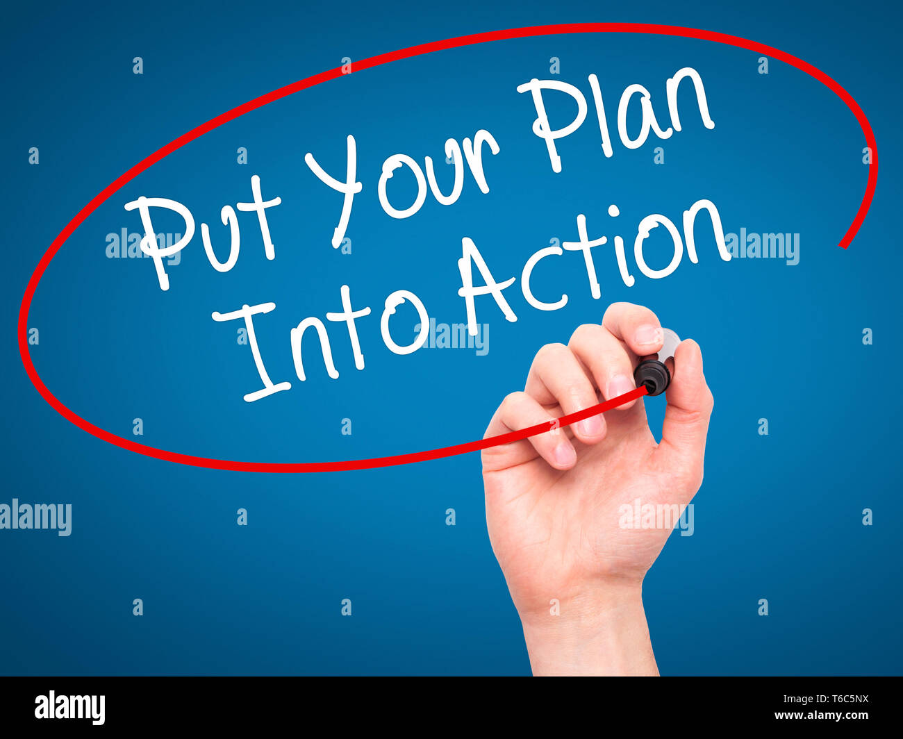 Man Hand writing Put Your Plan Into Action with black marker on visual ...