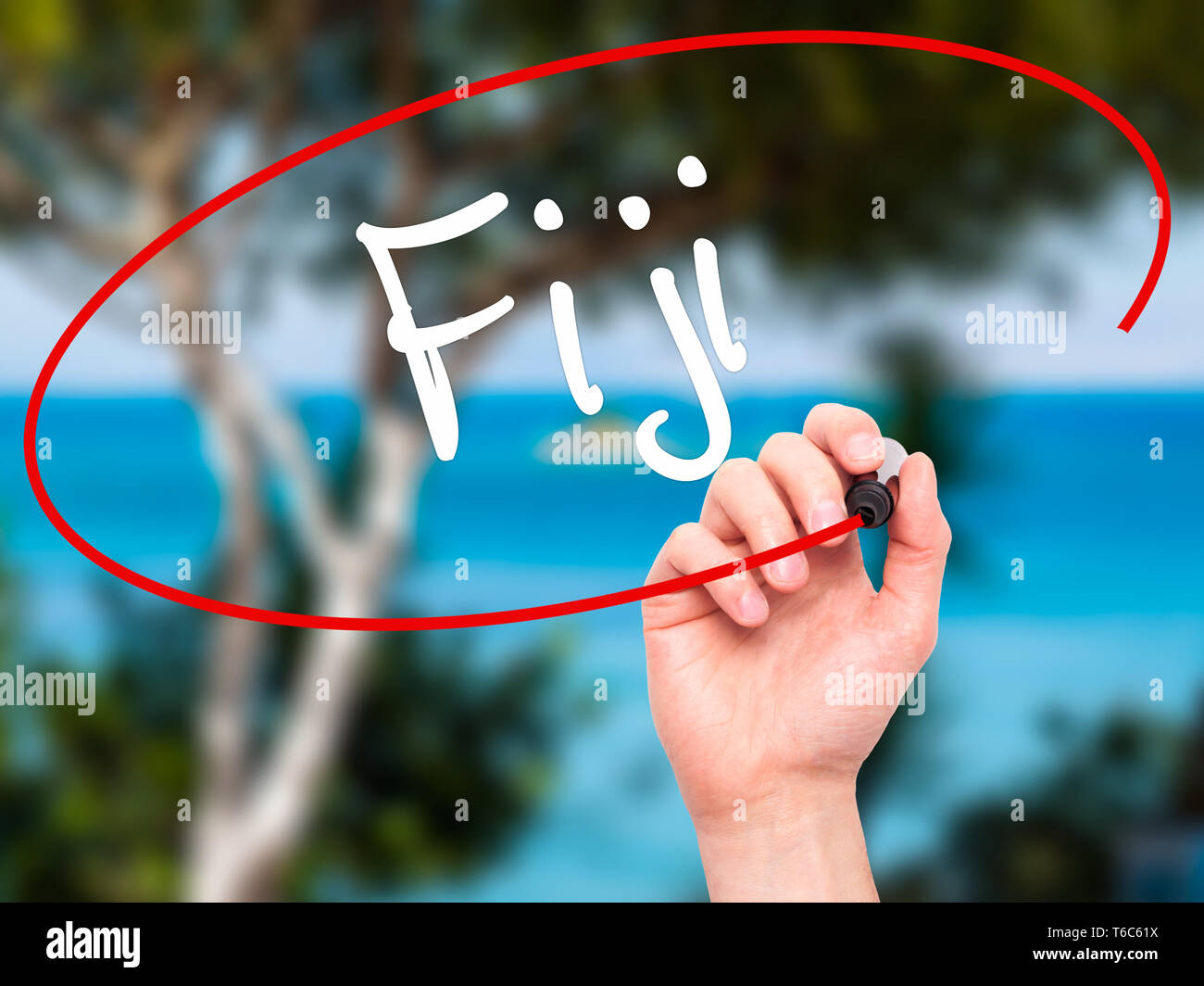 Man Hand writing Fiji with black marker on visual screen Stock Photo ...