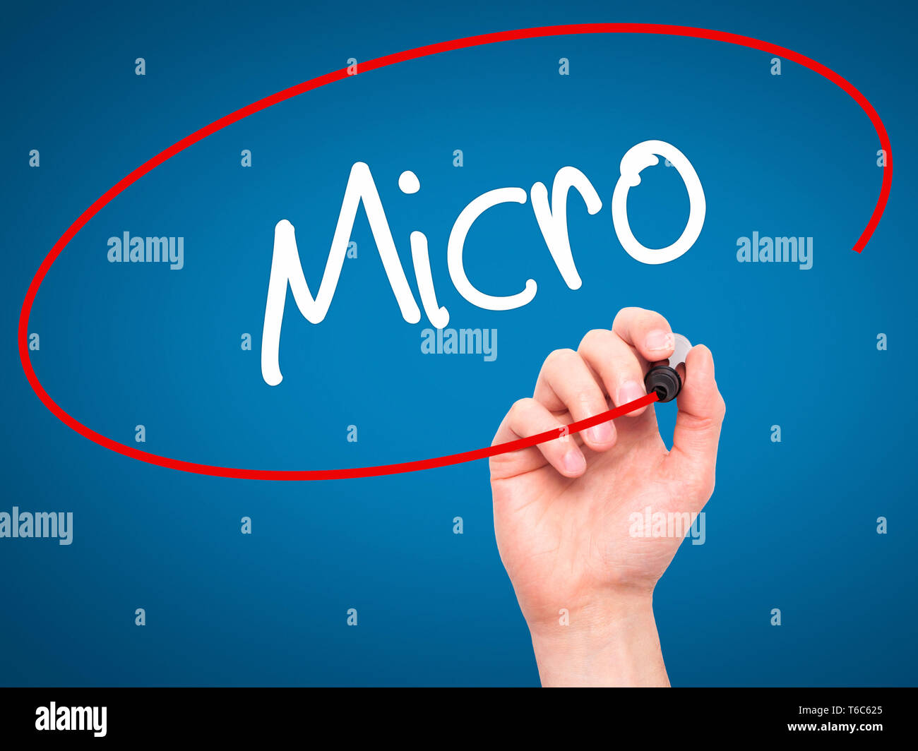 Man Hand writing Micro with black marker on visual screen Stock Photo ...