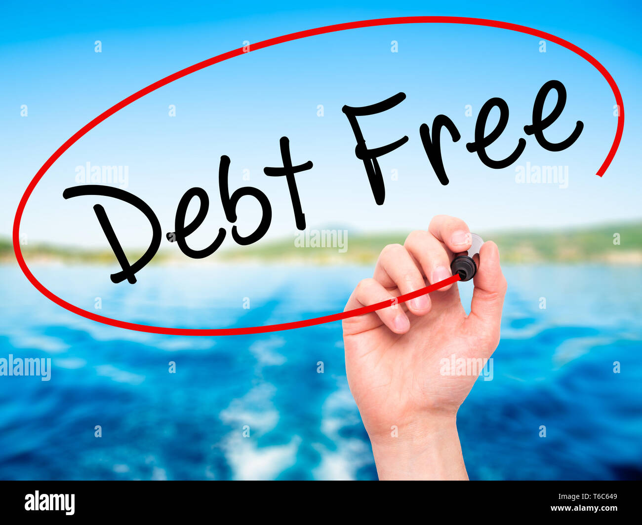 Man Hand writing Debt Free with black marker on visual screen Stock ...