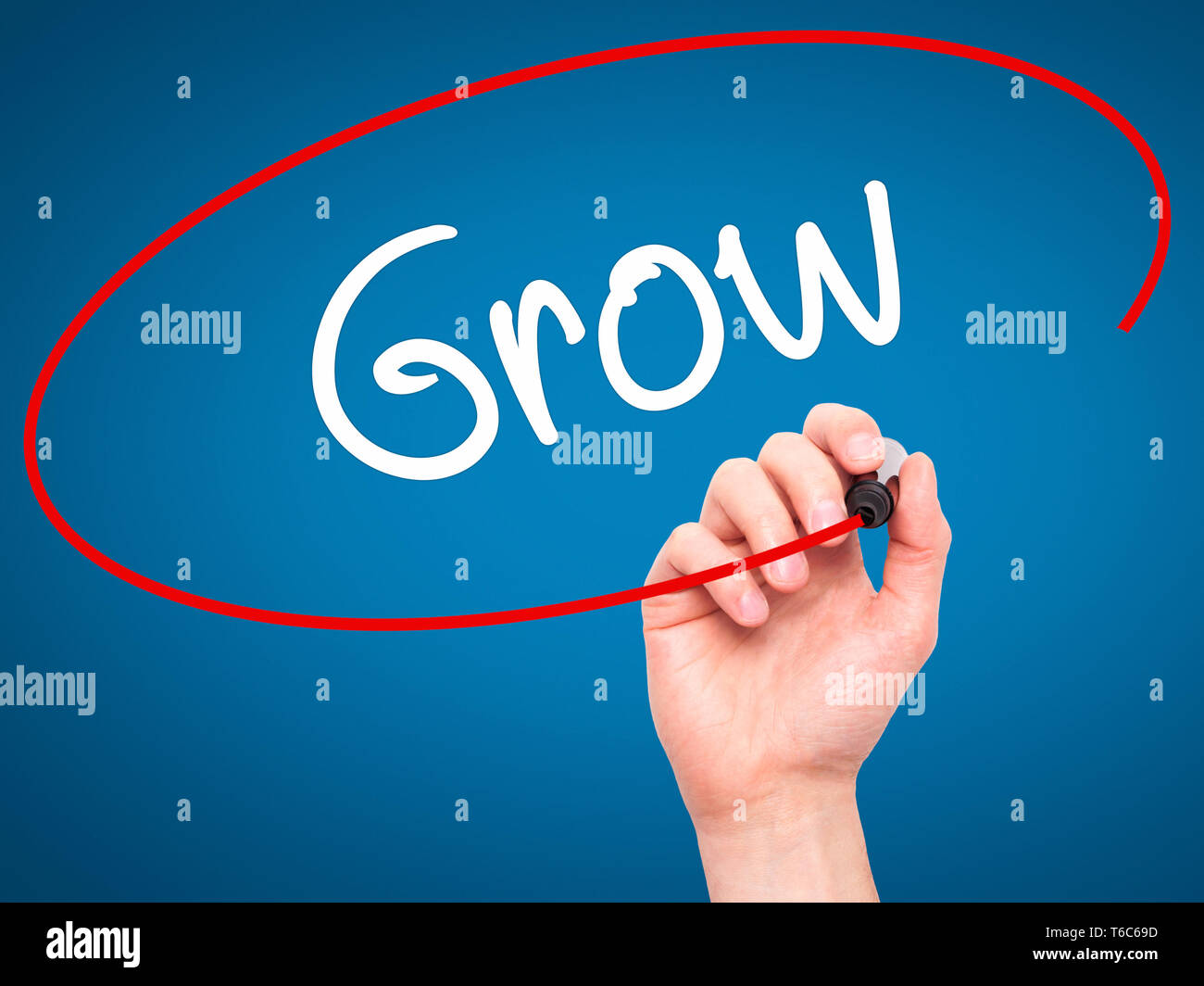 Man Hand writing Grow with black marker on visual screen Stock Photo ...