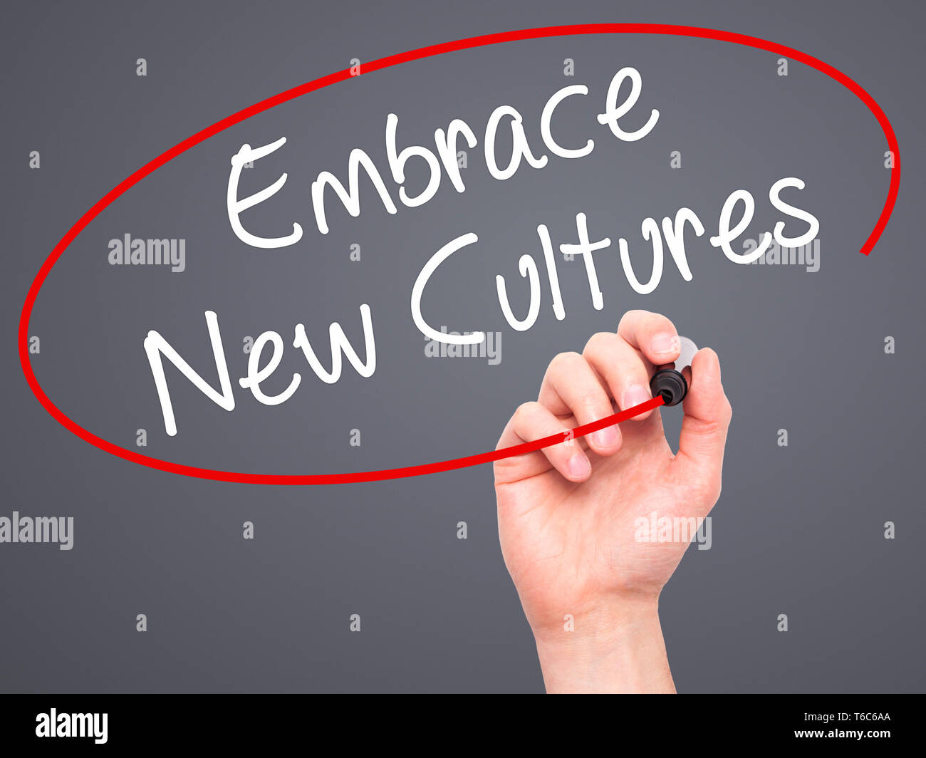 Man Hand writing Embrace New Cultures with black marker on visual ...