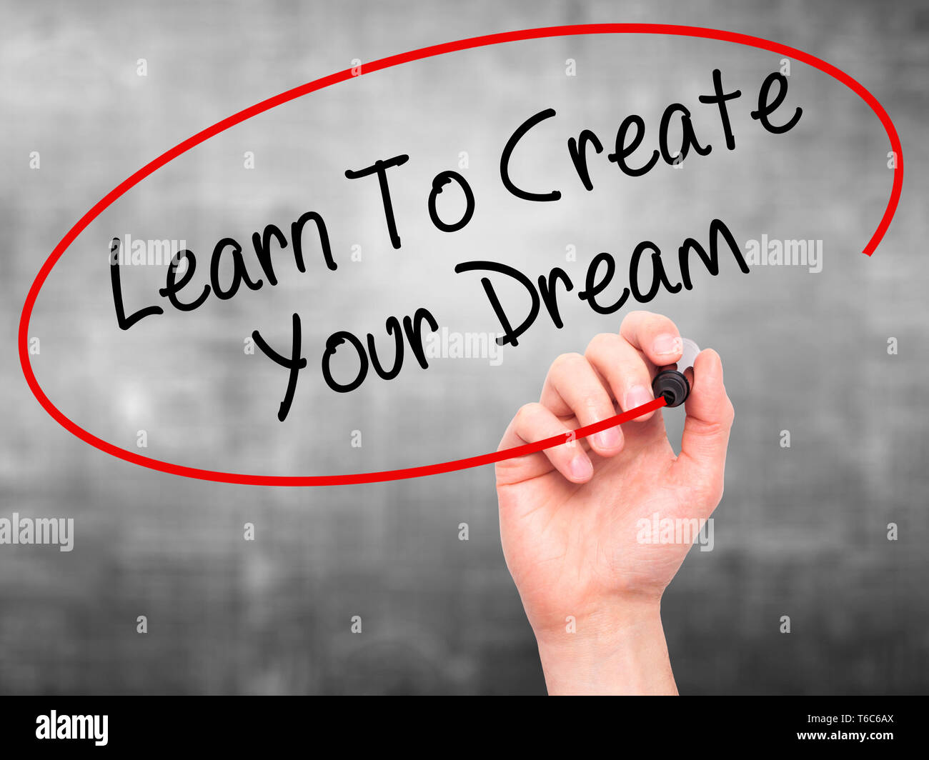 Man Hand writing Learn To Create Your Dream with black marker on visual ...