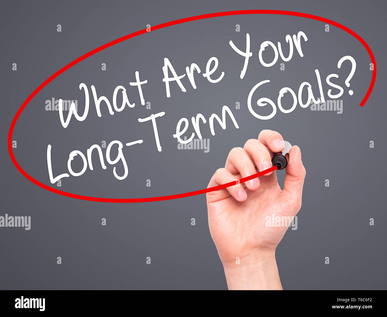 Man Hand writing What Are Your Long-Term Goals? with black marker on ...