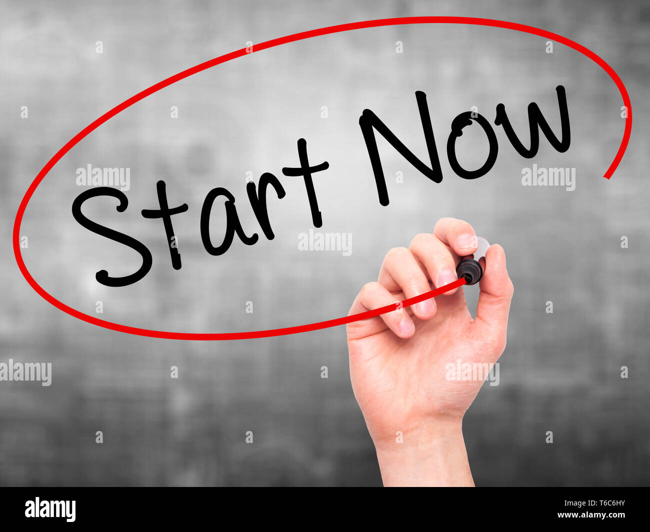 Man Hand writing Start Now with black marker on visual screen Stock ...