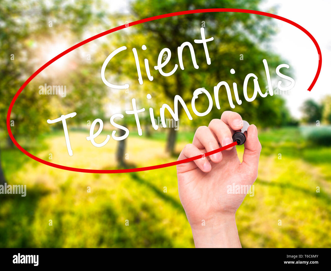 Man Hand writing Client Testimonials with black marker on visual screen ...