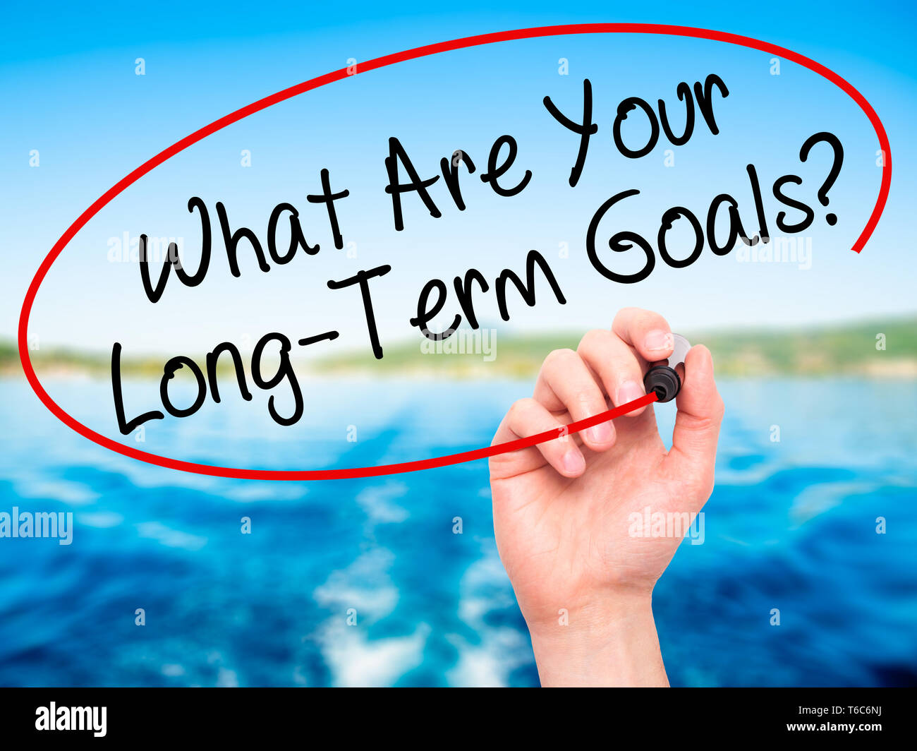 Man Hand writing What Are Your Long-Term Goals? with black marker on ...