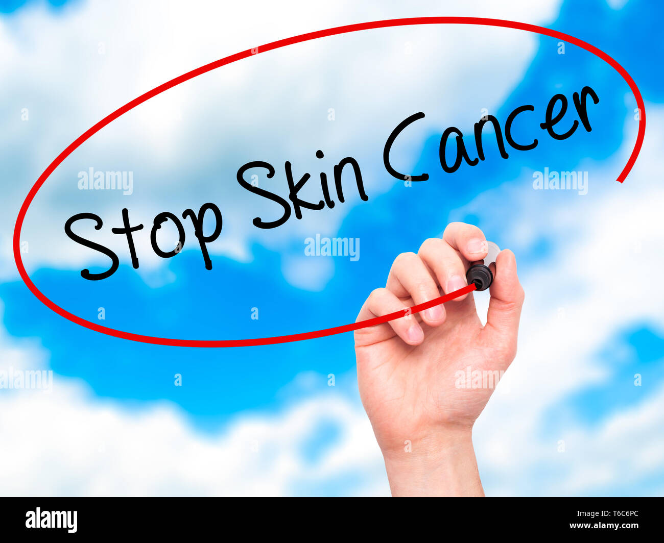 Man Hand writing Stop Skin Cancer with black marker on visual screen ...