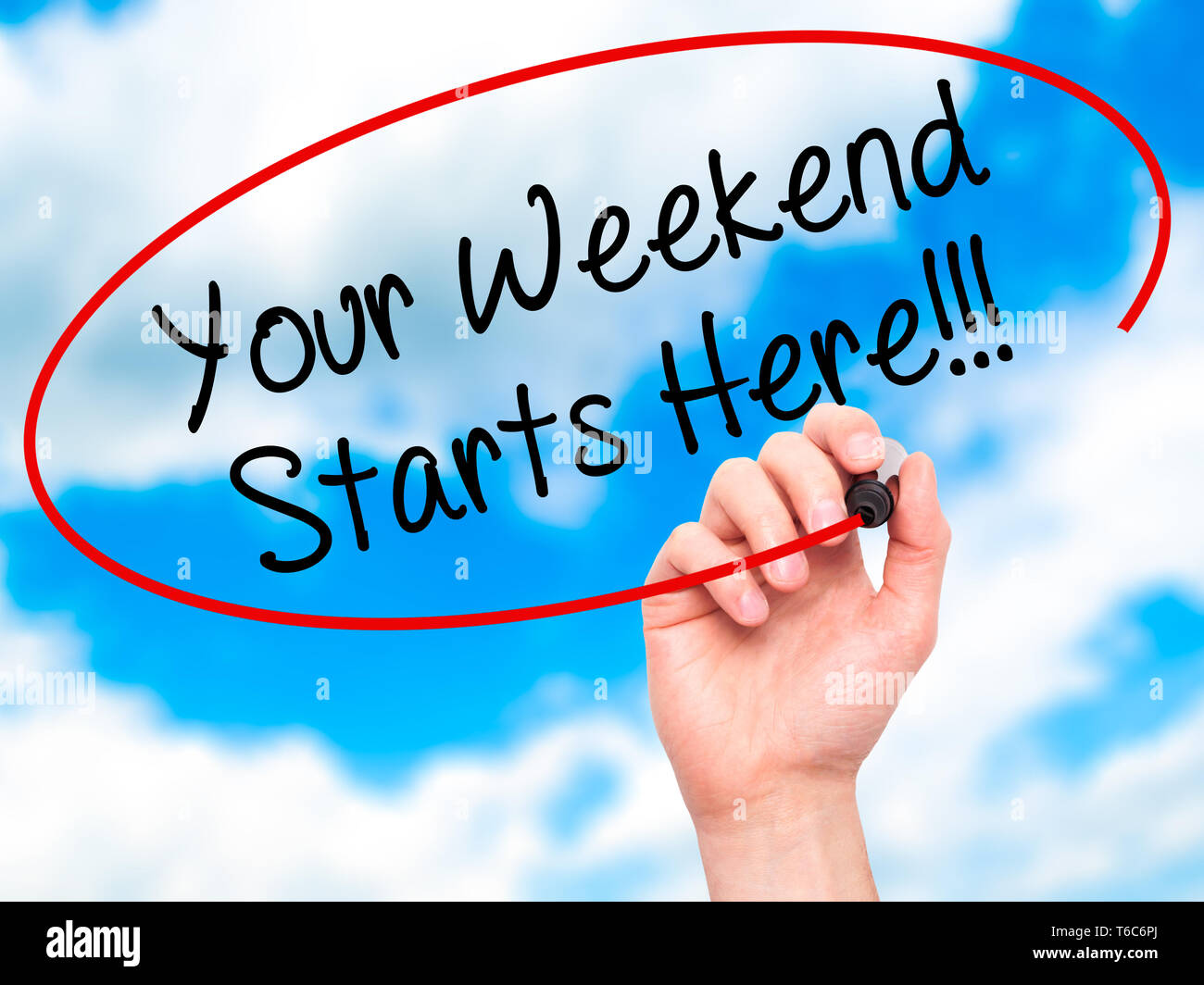 Man Hand writing Your Weekend Starts Here!!! with black marker on ...