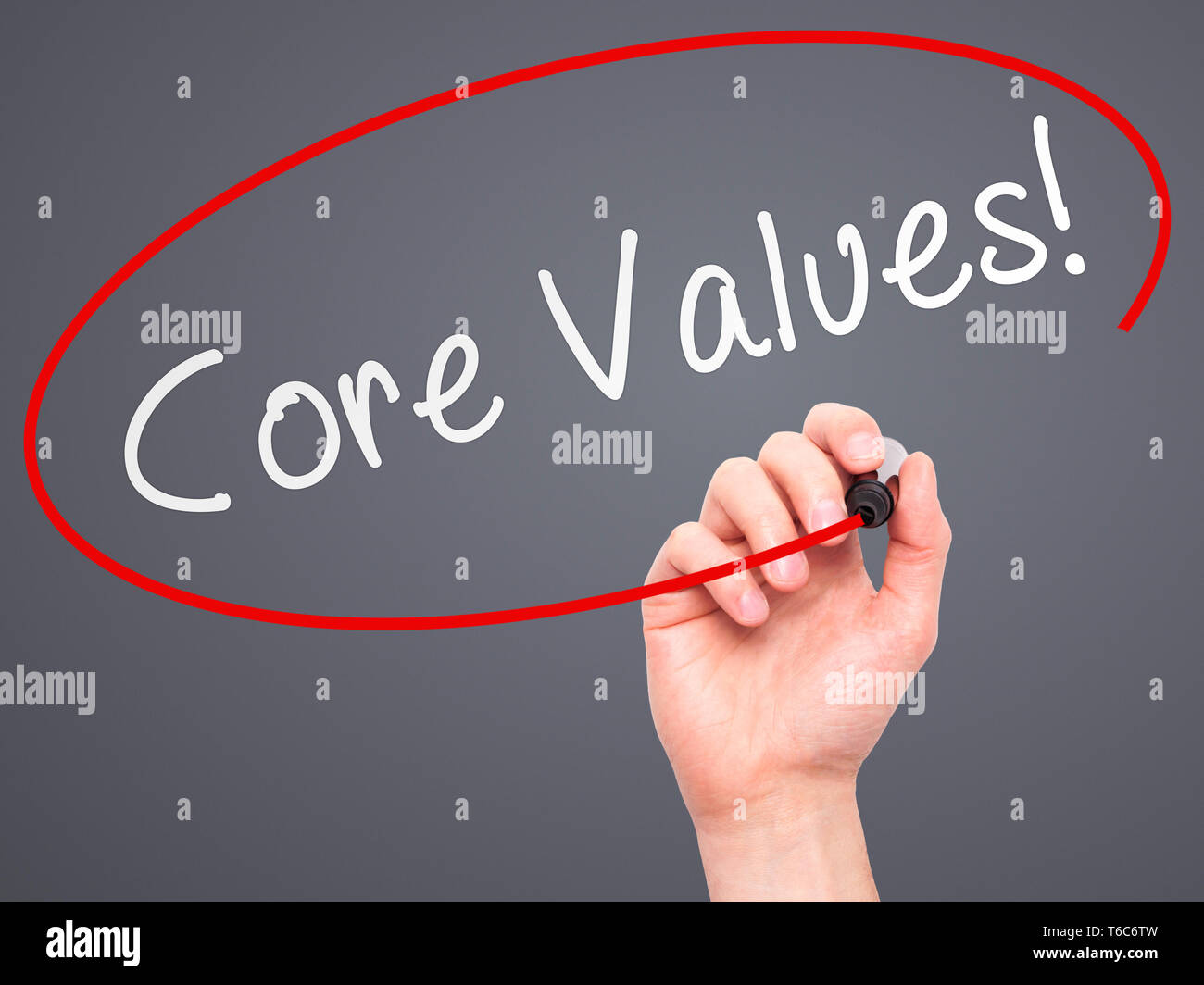 Man Hand writing Core Values with marker on transparent wipe board ...