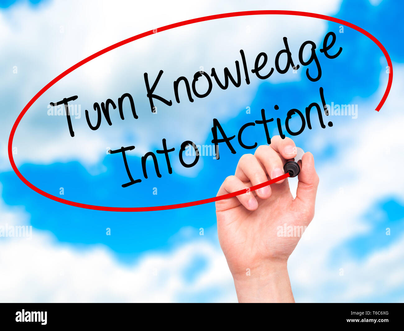 Man Hand writing Turn Knowledge Into Action! with black marker on ...