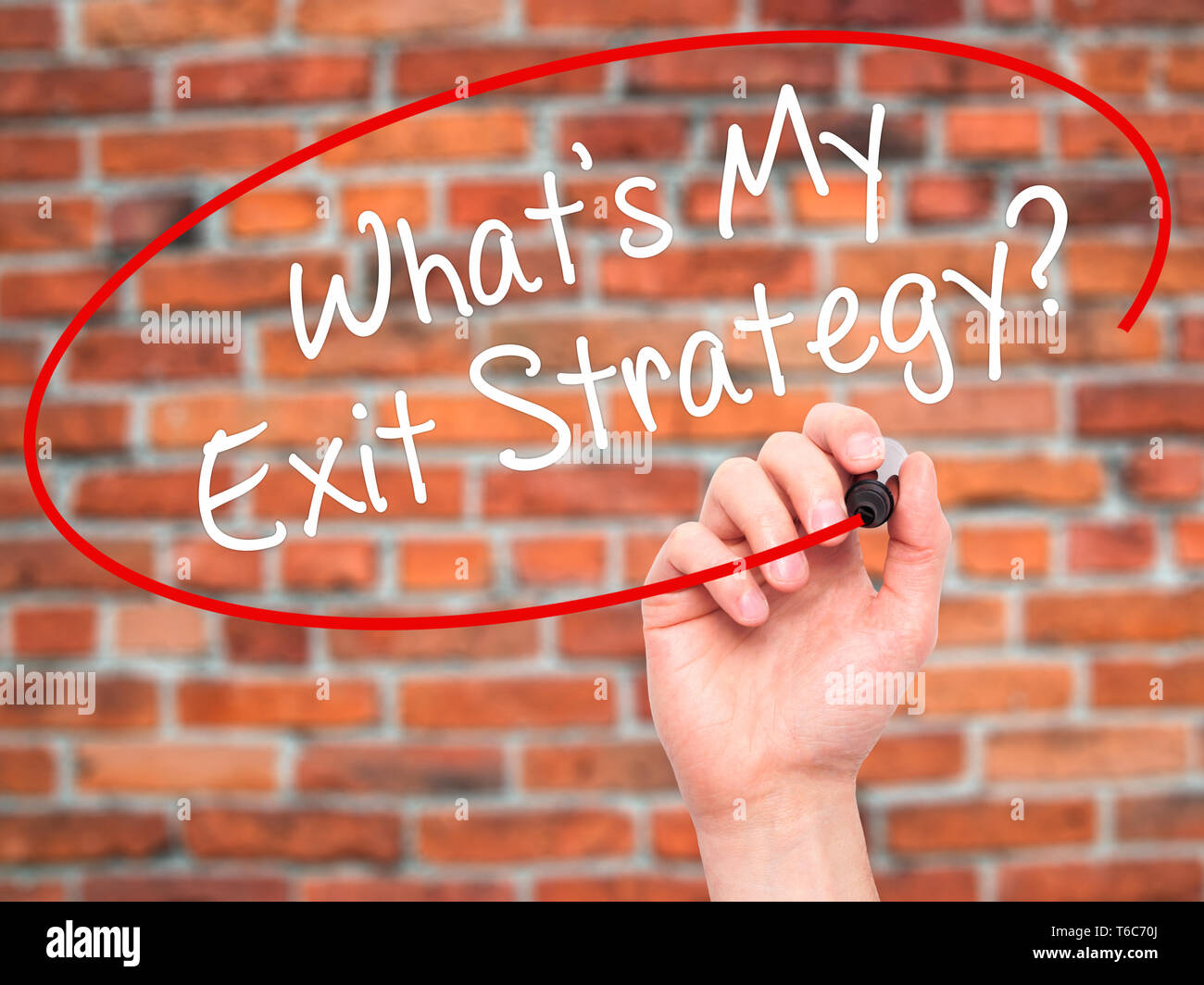 Man Hand writing What's My Exit Strategy? with black marker on visual ...