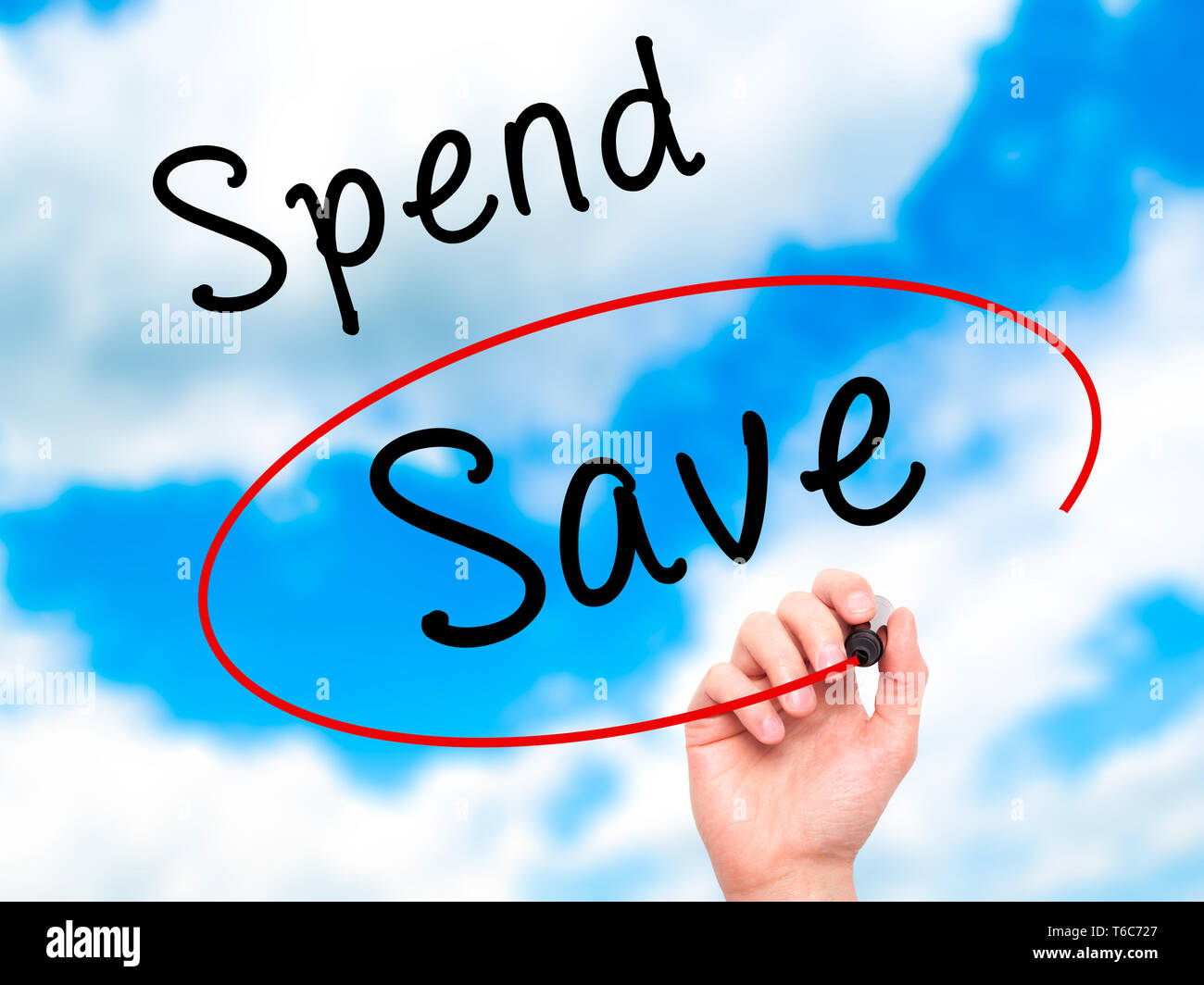 Man Hand writing and choosing Save instead of Spend with black marker ...