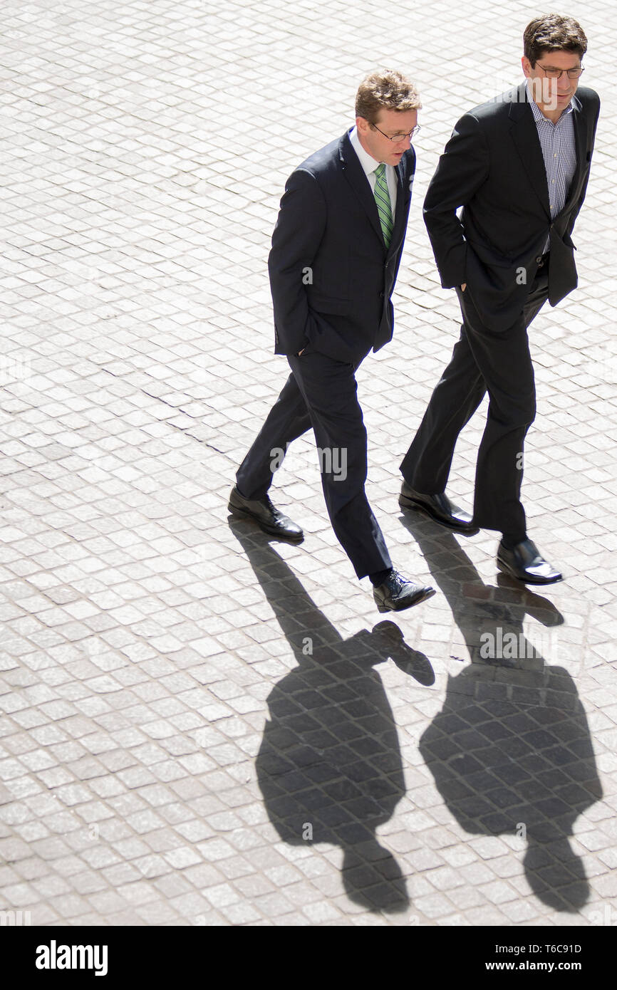 Two men in suits on their way to the NYSE Euronext Stock Exchange on ...