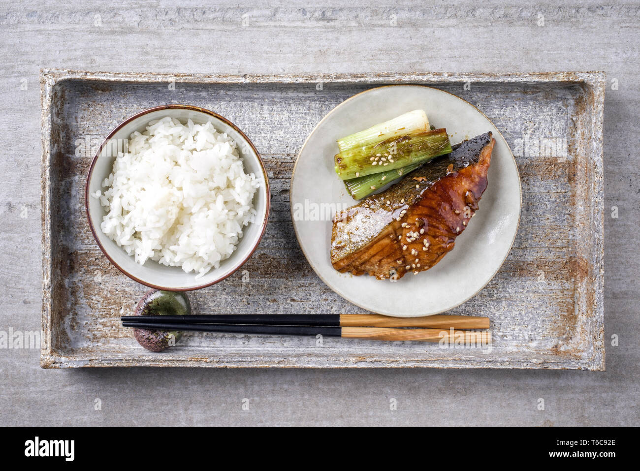 Traditional Japanese Fish Teriyaki and Rice as close-up on a tray Stock ...
