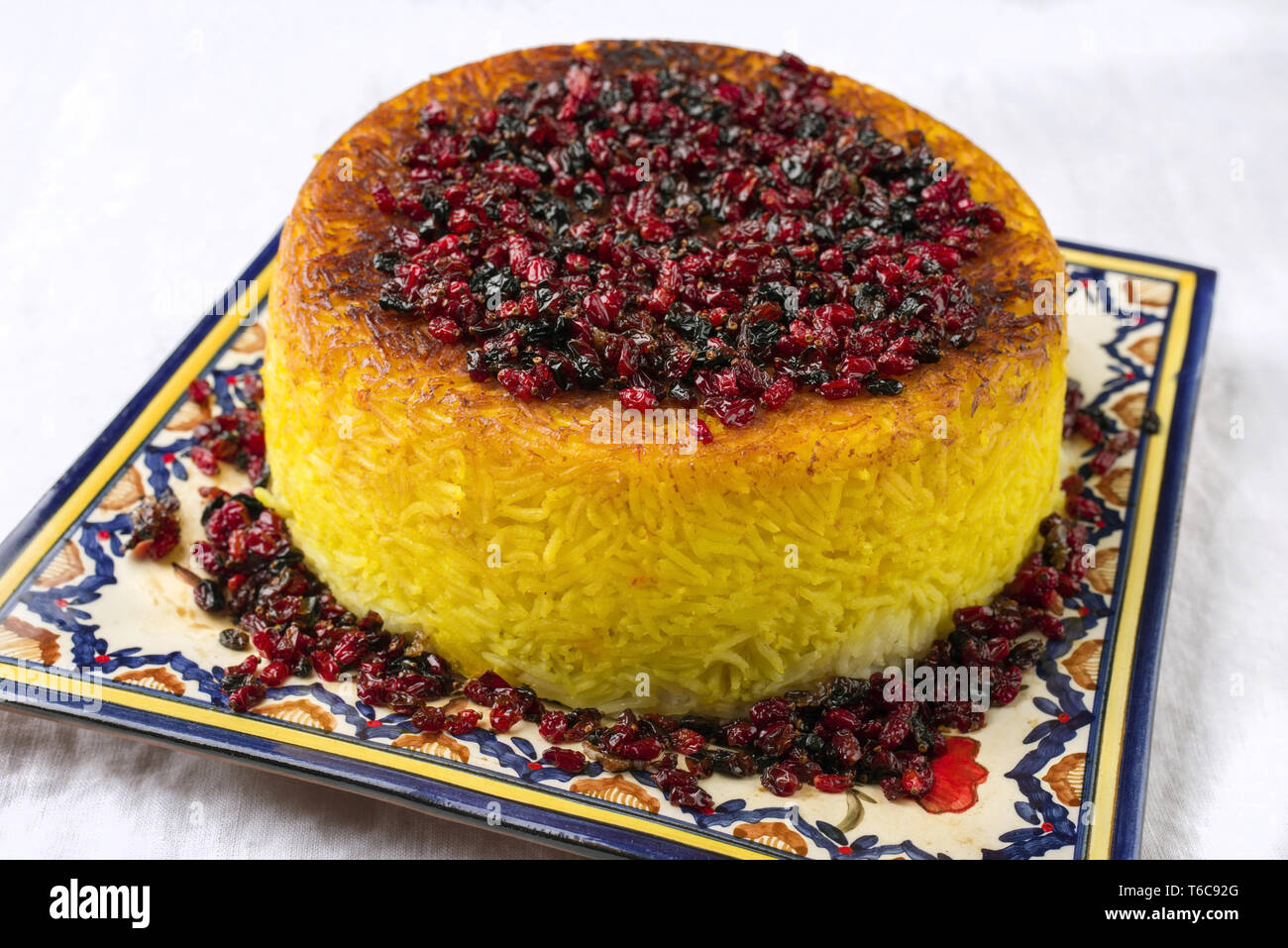 Traditional Iranian Rice Pie Tahdig Polo with Berberis as close-up on a ...