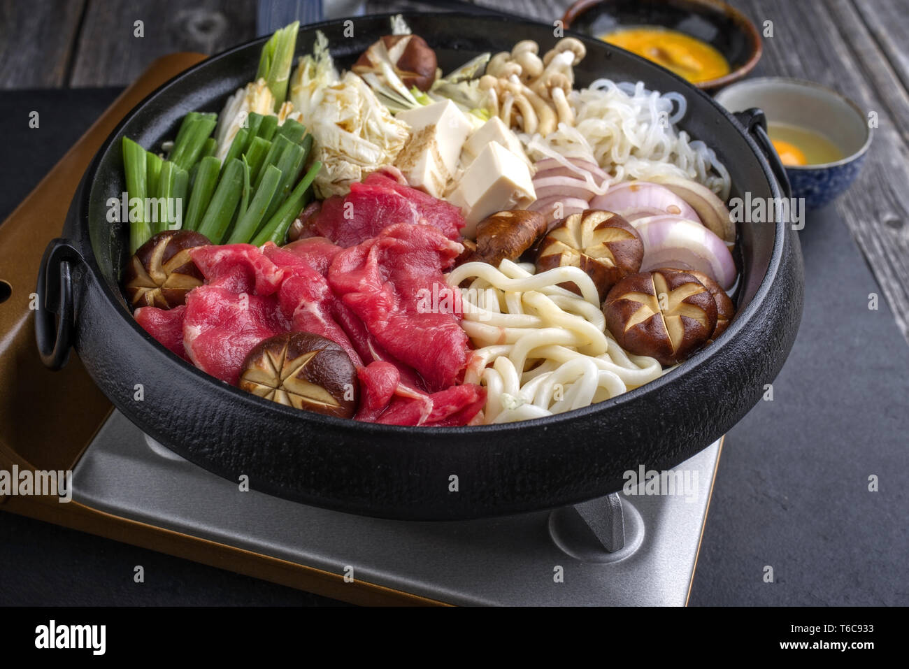 Traditional Sukiyaki pot with Kobe Beef and Vegetable as close-up on ...