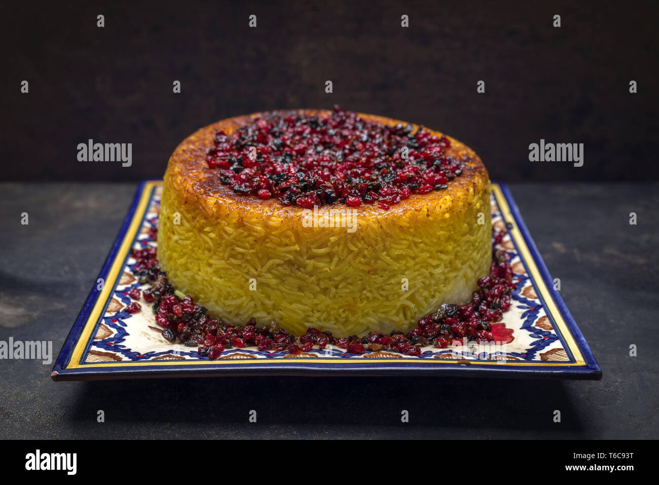 Traditional Iranian rice pie Tahdig Polo with Berberis on a plate Stock ...
