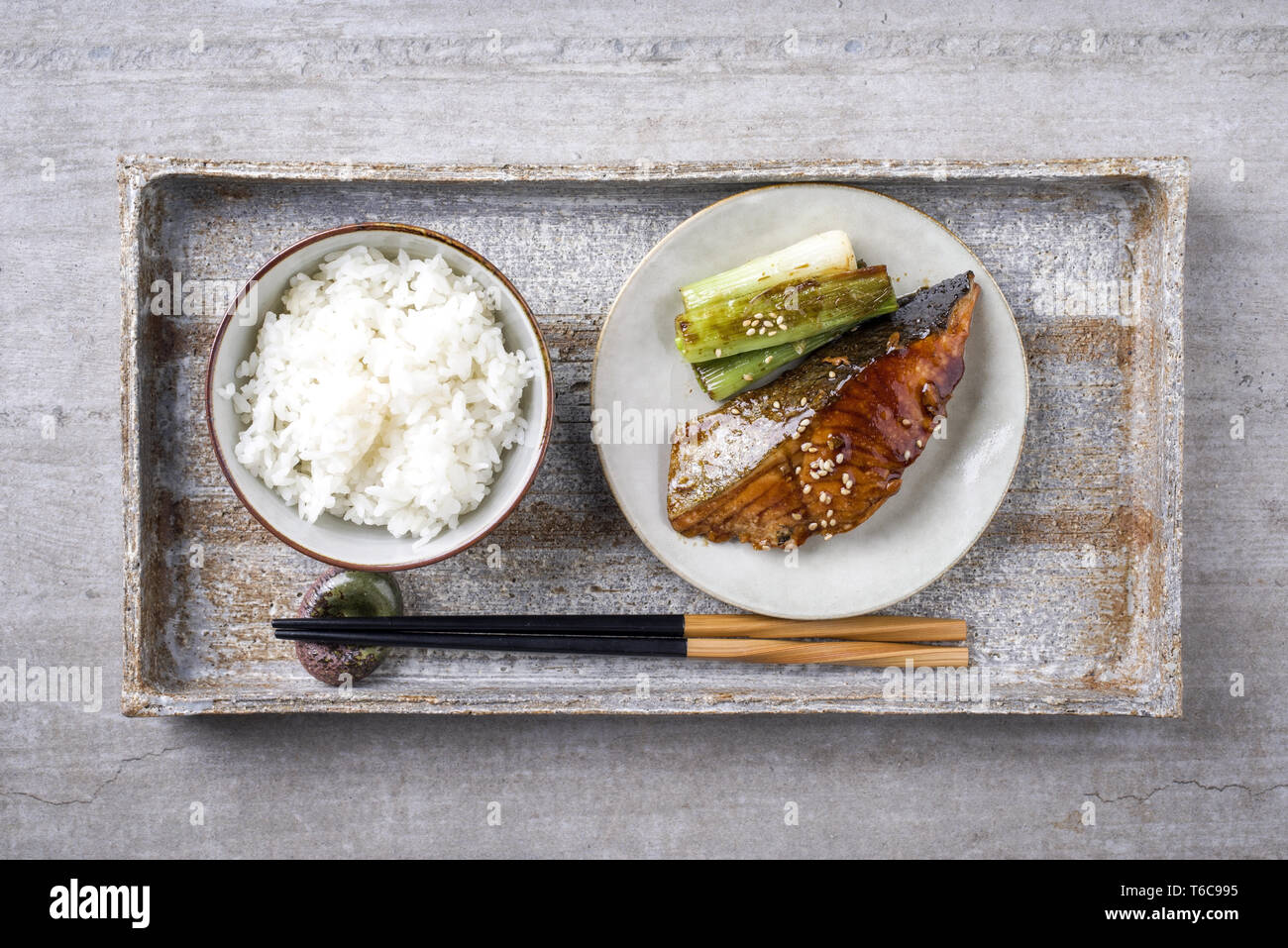 Traditional Japanese Fish Teriyaki and Rice as close-up on a tray Stock ...