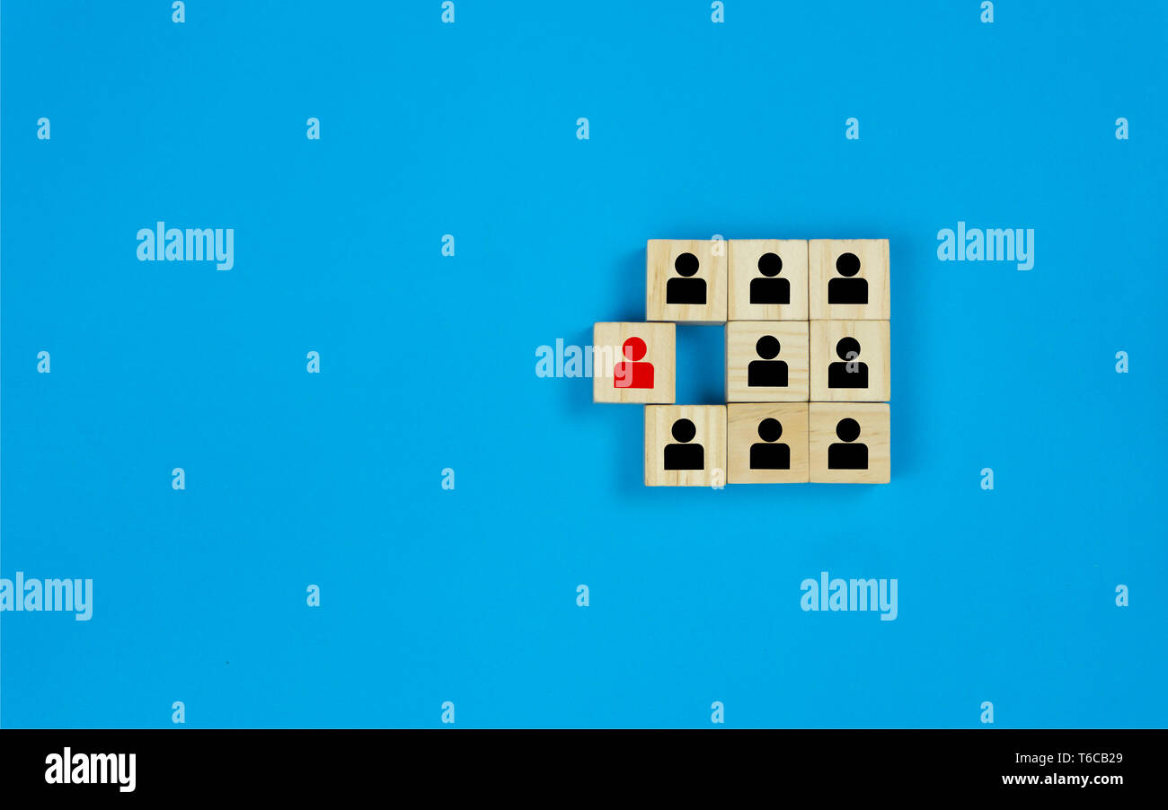 Leadership and think different concept. Red businessman icon on wooden ...