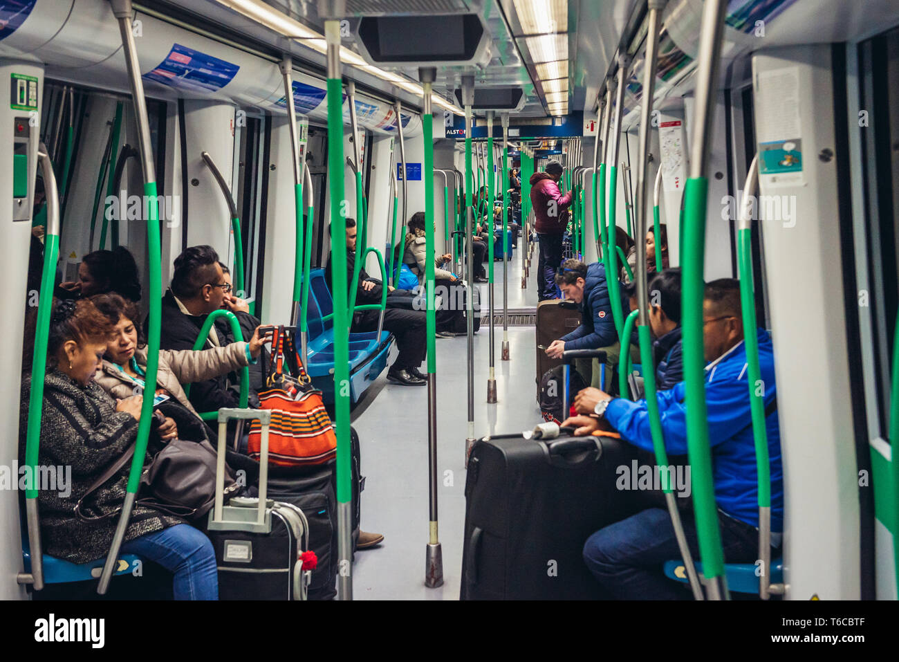 Passengers in train of subway system in Madrid, Spain Stock Photo - Alamy