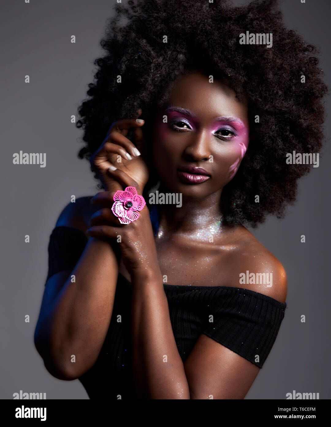 Afro and Flower beauty with big black hair smooth dark skin Stock Photo ...