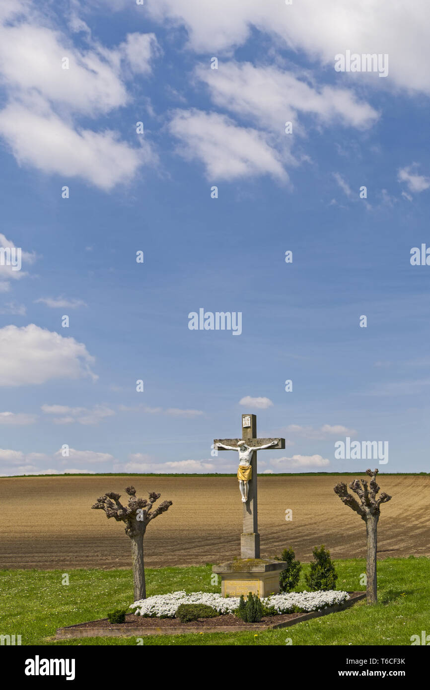 Field cross with Christ figure Stock Photo - Alamy