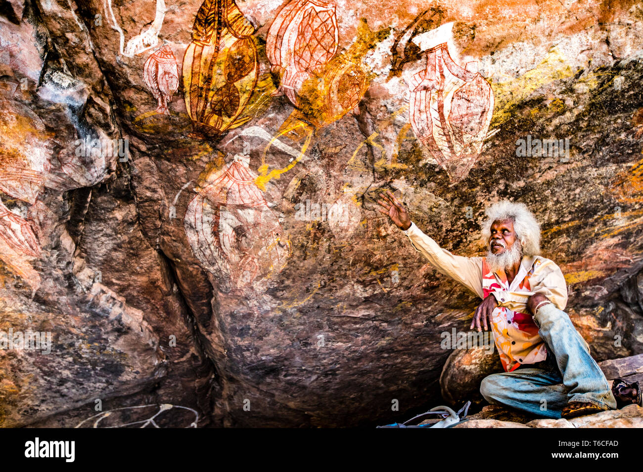 Native Guide explaining Aborigine Rock Art in Long Tom Dreaming ...